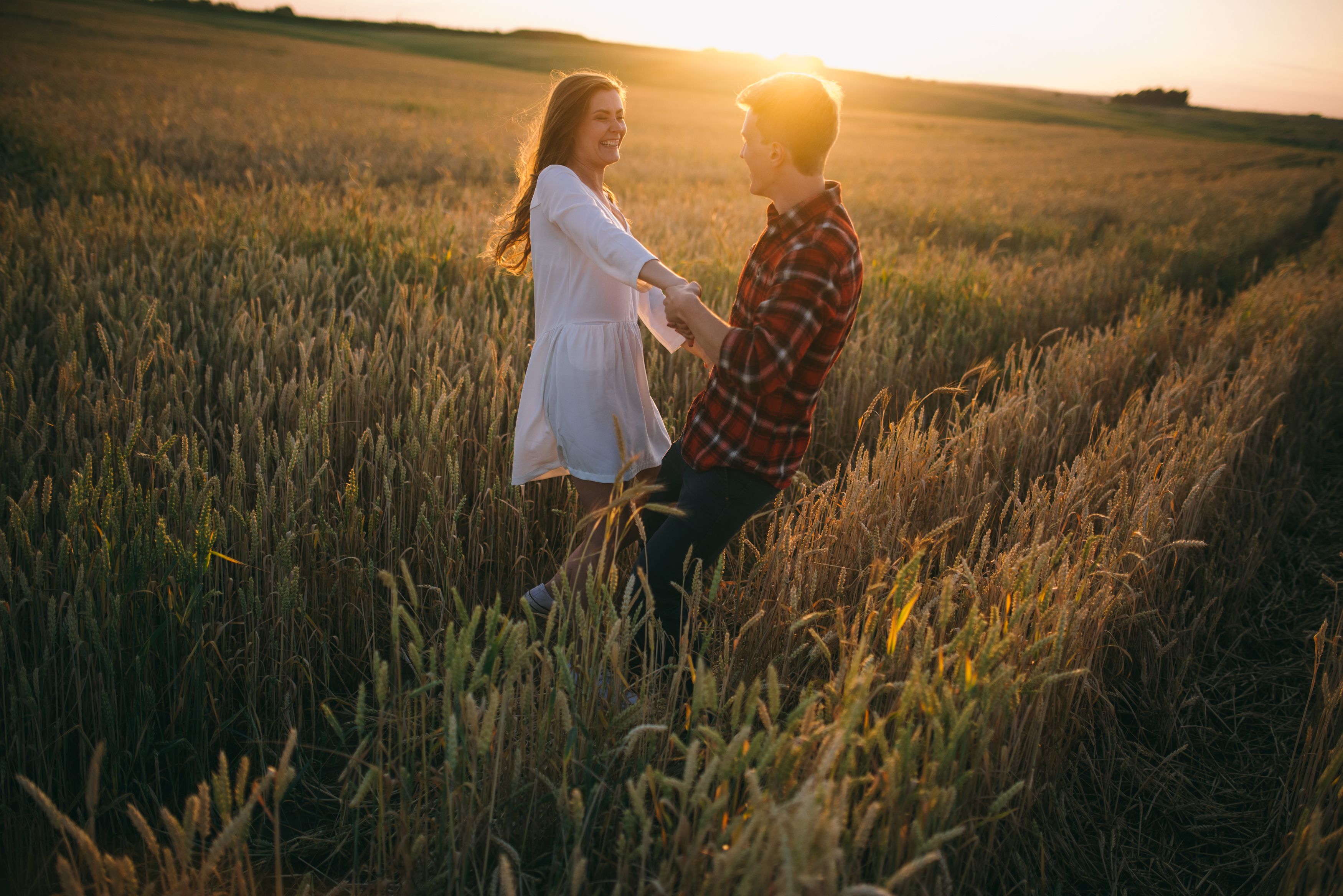 A Man Planting a Kiss on a Woman's Head · Free Stock Photo