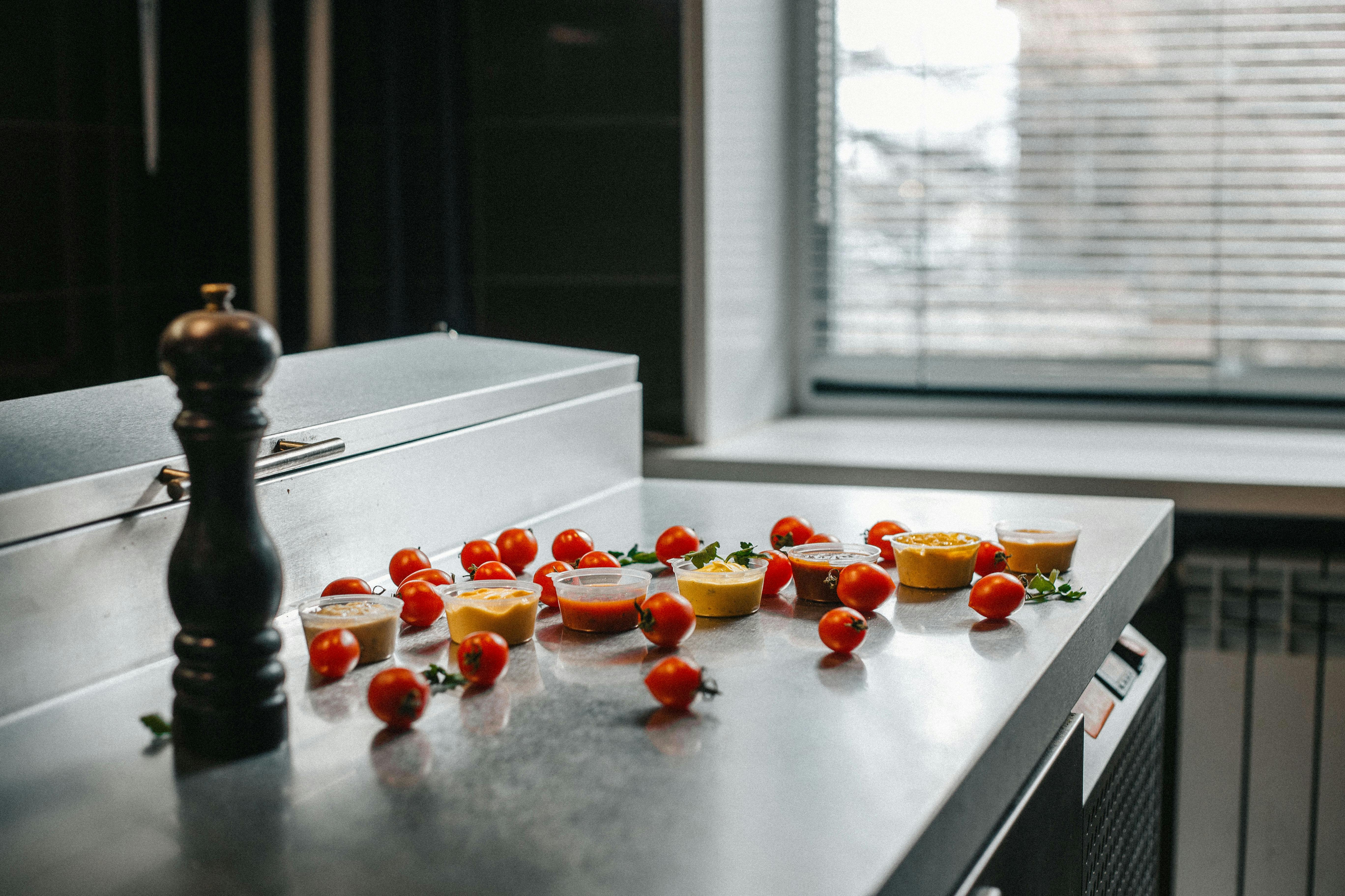 Red Tomatoes and Sauces on a Kitchen Counter · Free Stock Photo