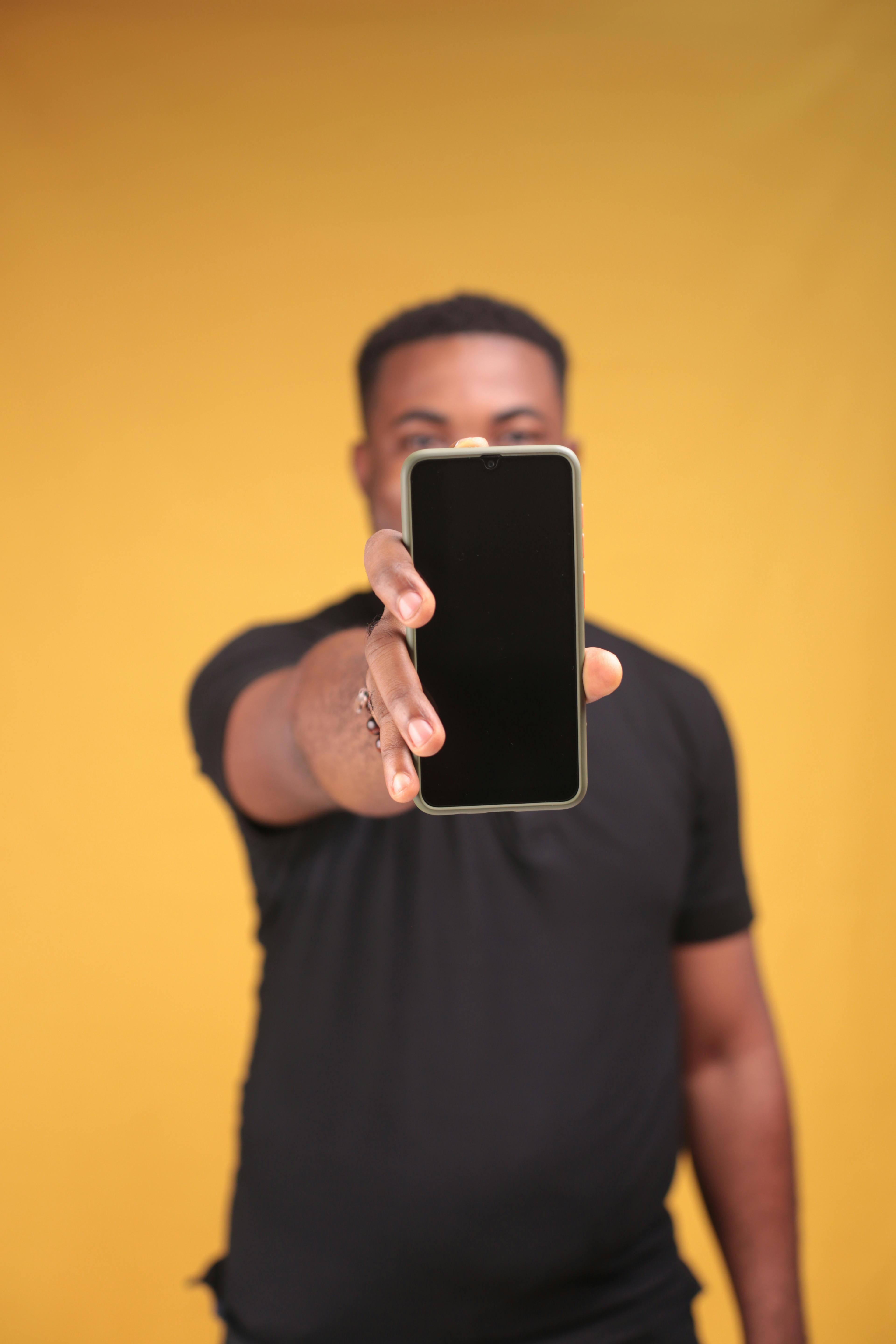 person Showing His Smartphone · Free Stock Photo