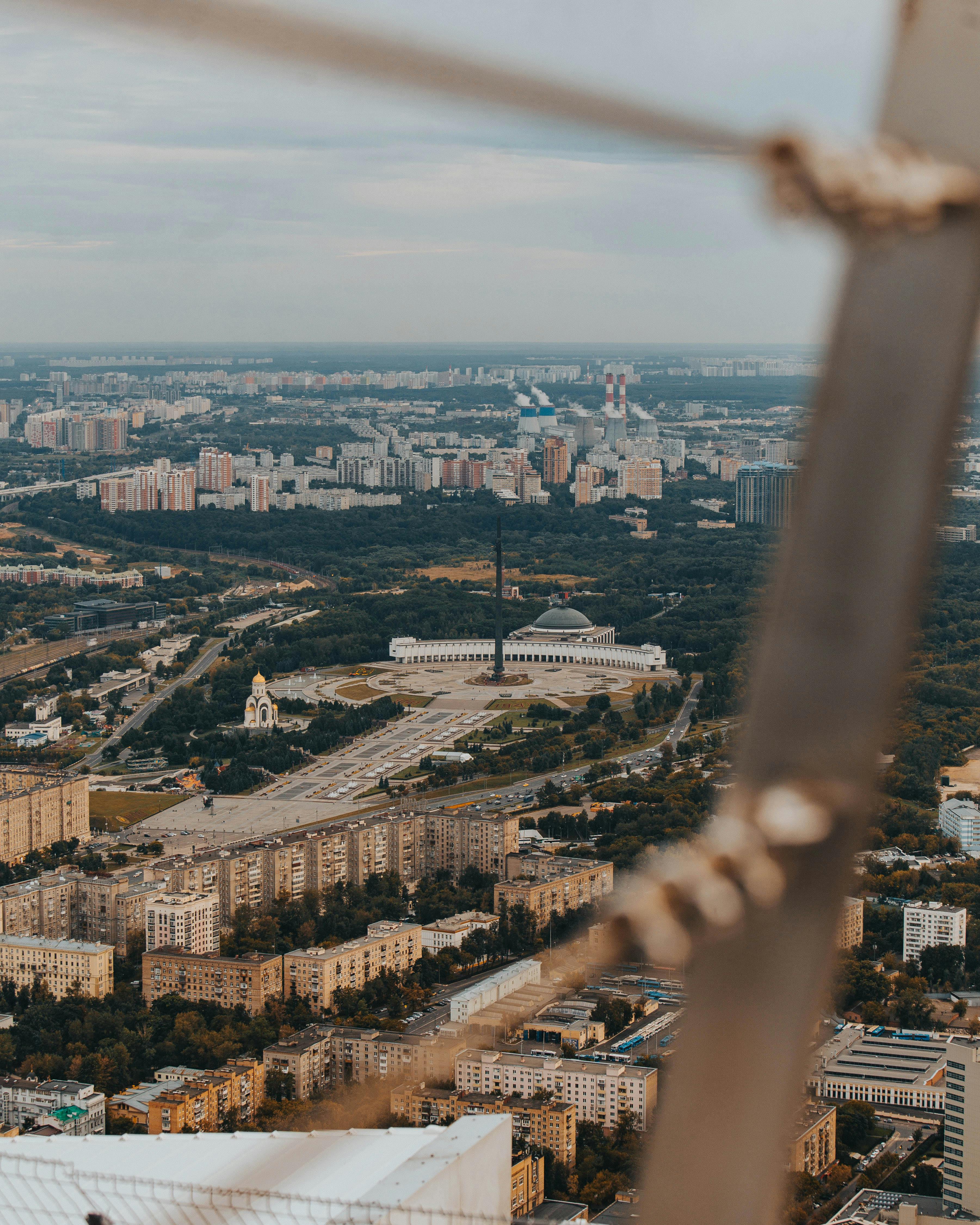 Aerial View of City Buildings Near Green Trees · Free Stock Photo