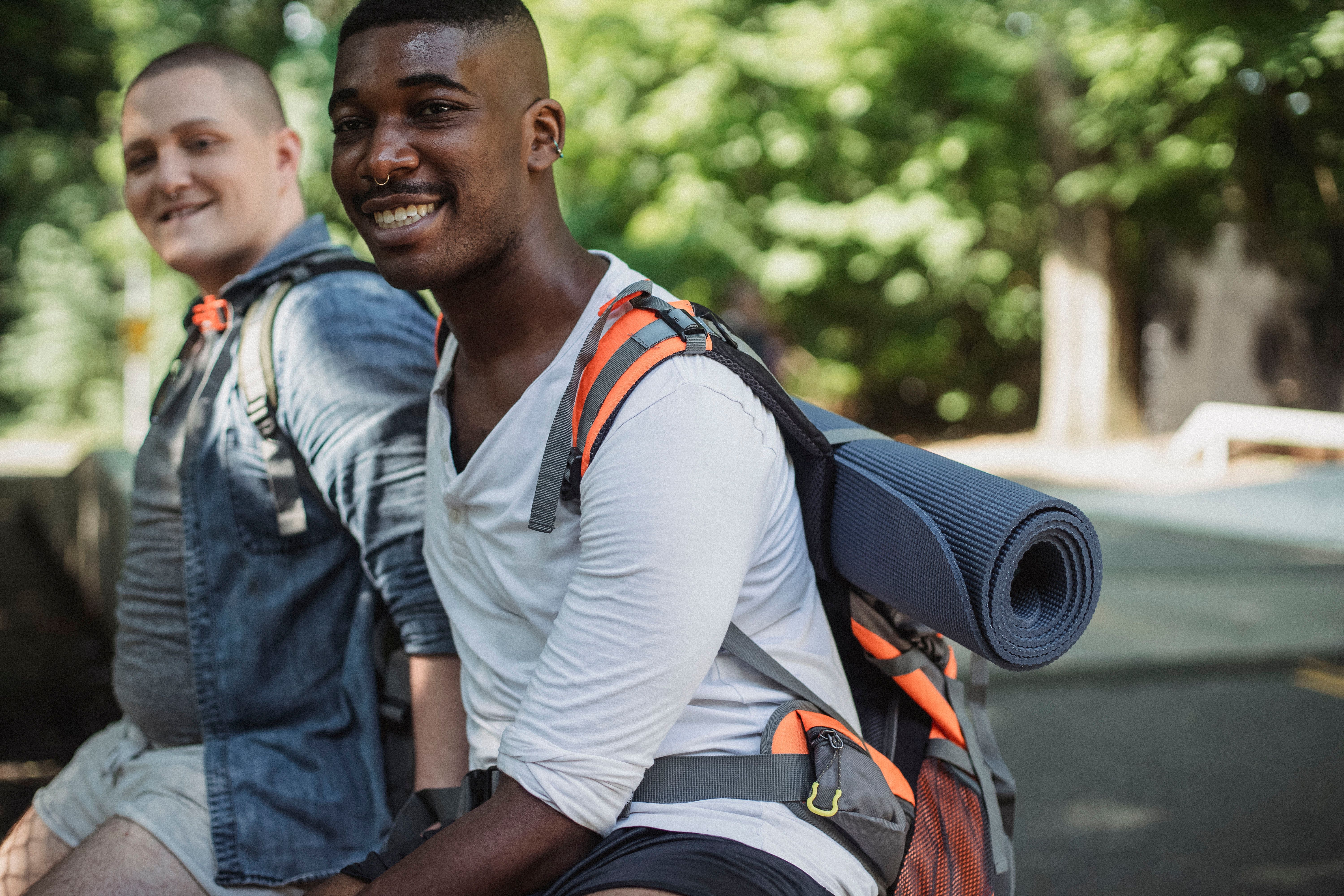 Smiling black man resting during hike · Free Stock Photo