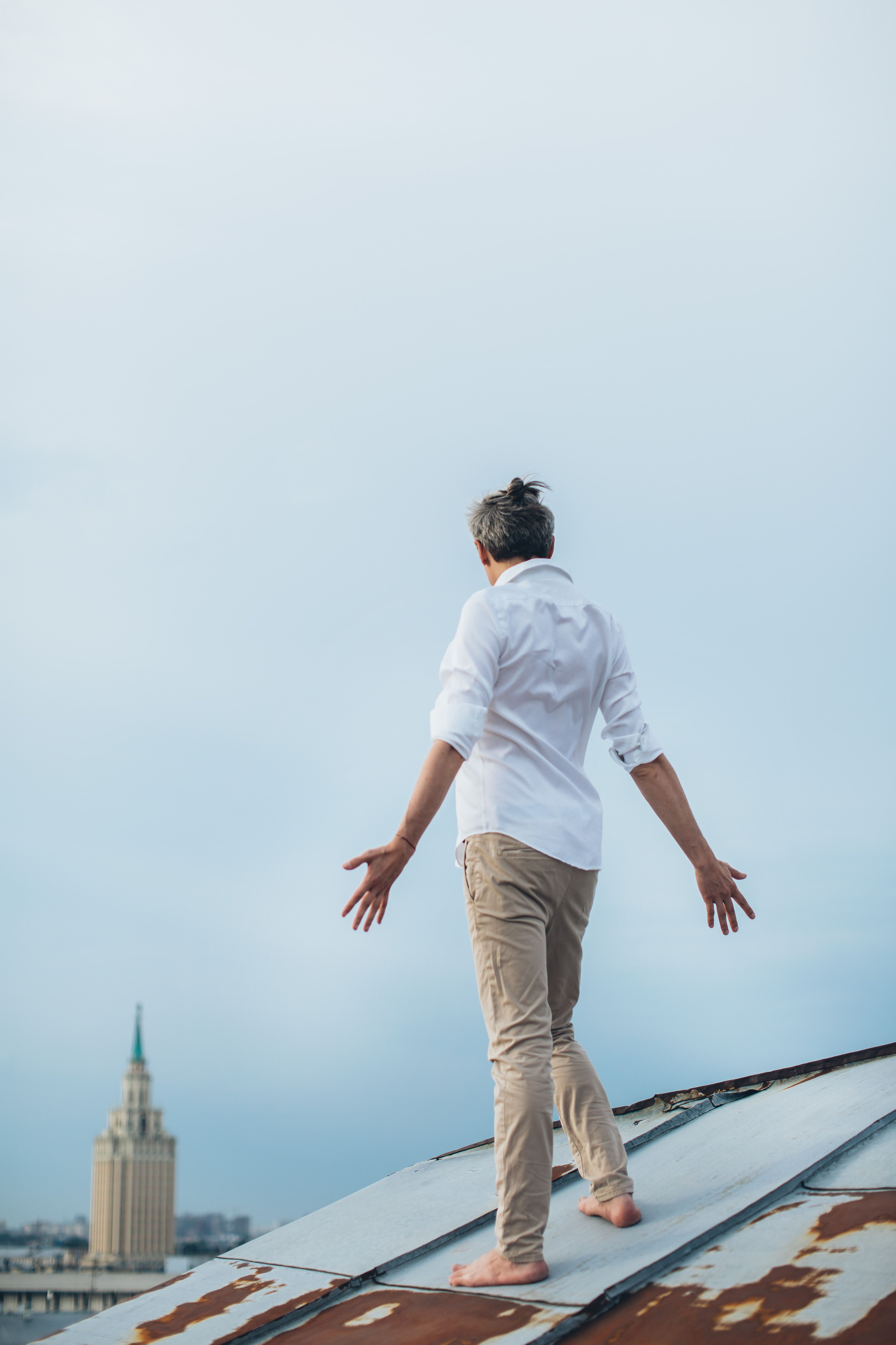 Man Standing On Roof Photos, Download The BEST Free Man Standing On ...