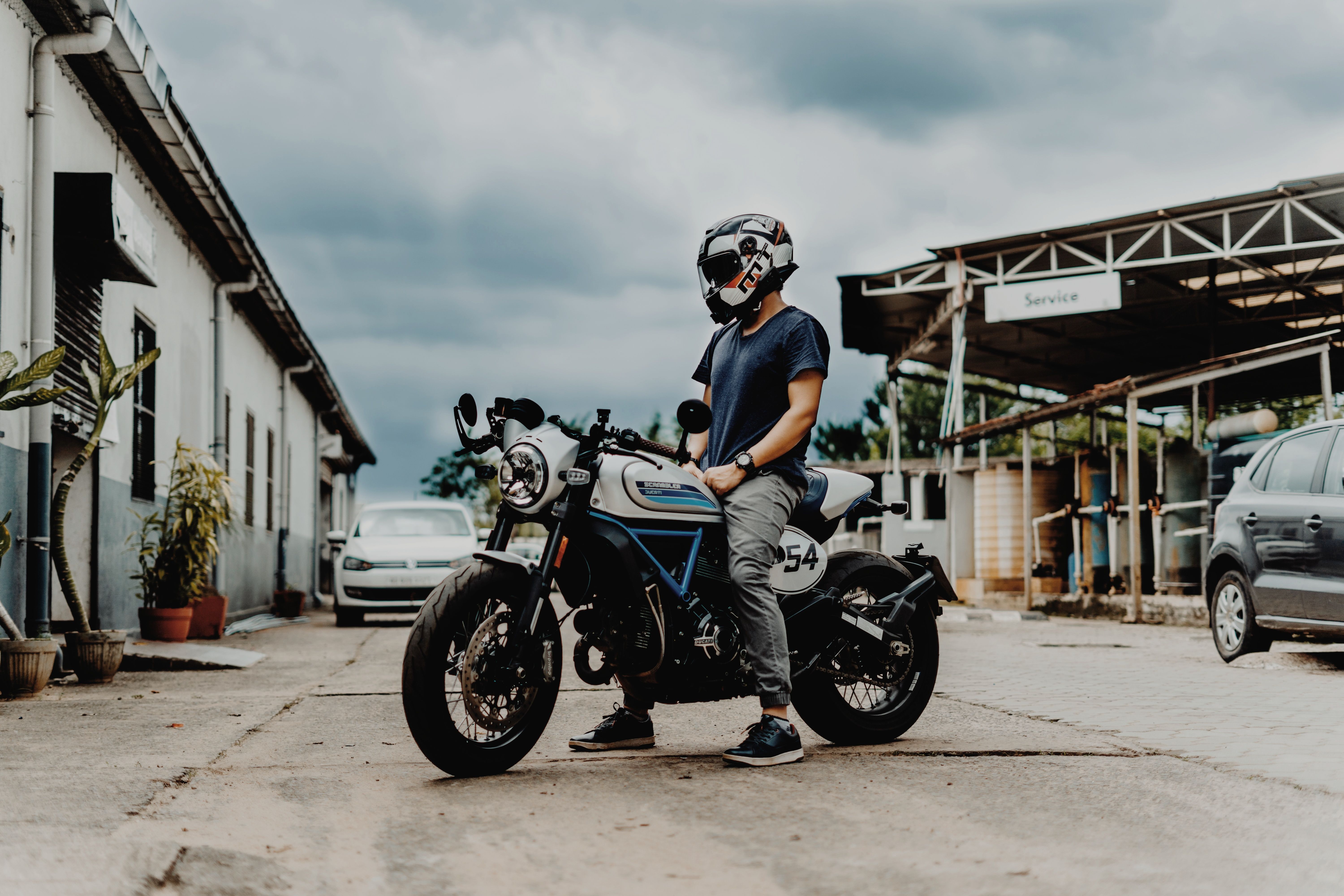 Person Wearing White Helmet Riding on Motorcycle · Free Stock Photo