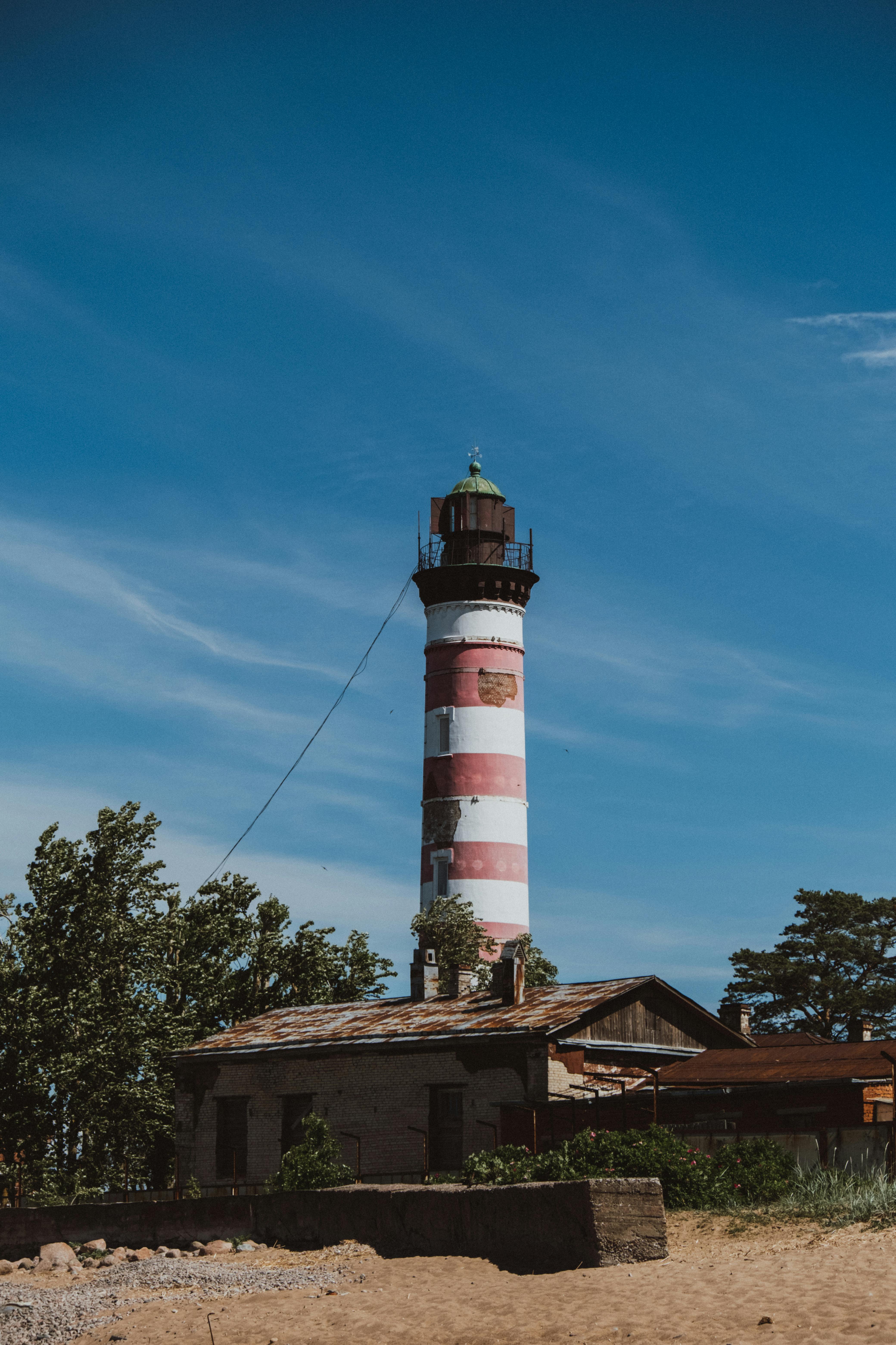 White and Red Lighthouse Under Blue Sky · Free Stock Photo