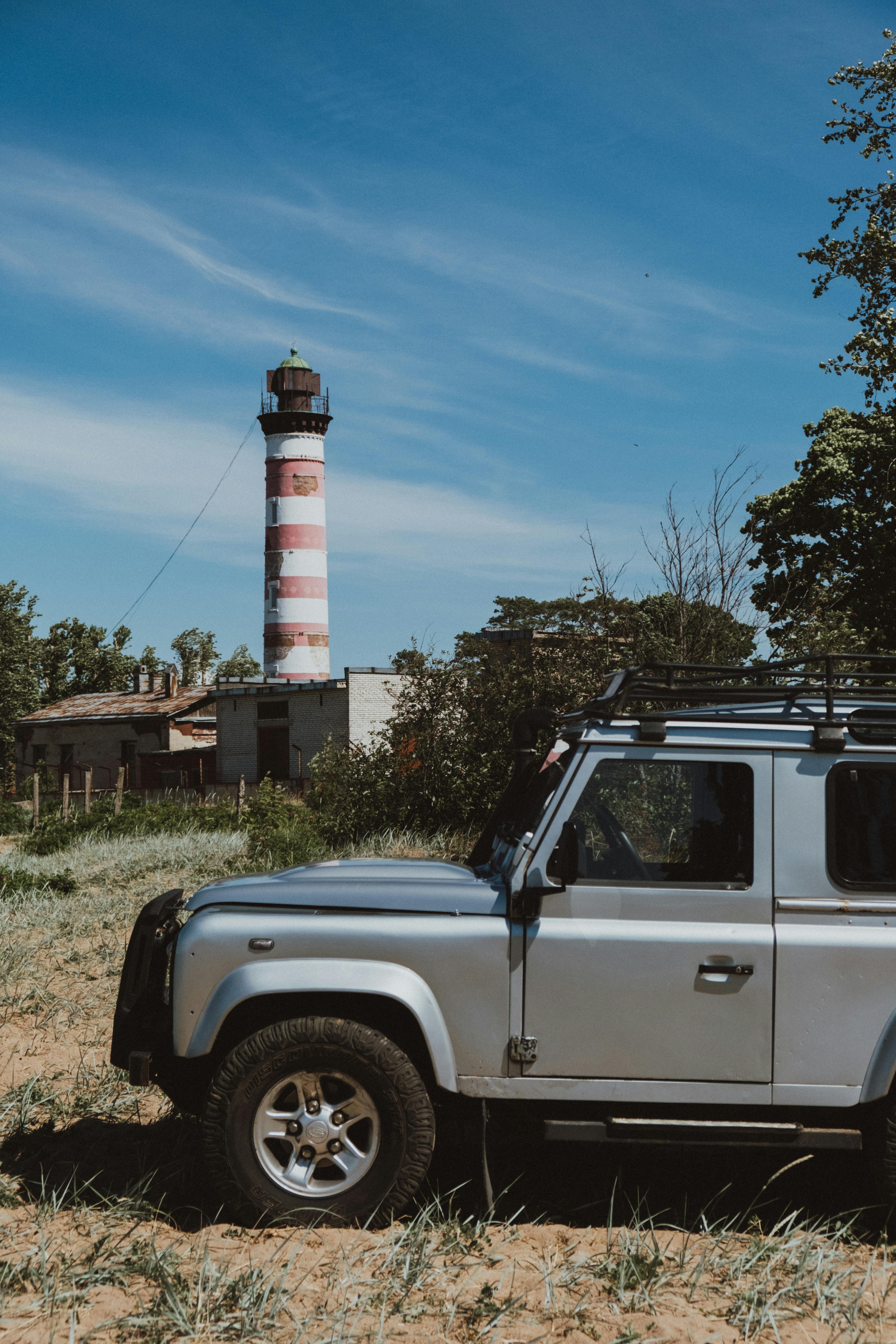 Vehicle Near a Lighthouse · Free Stock Photo