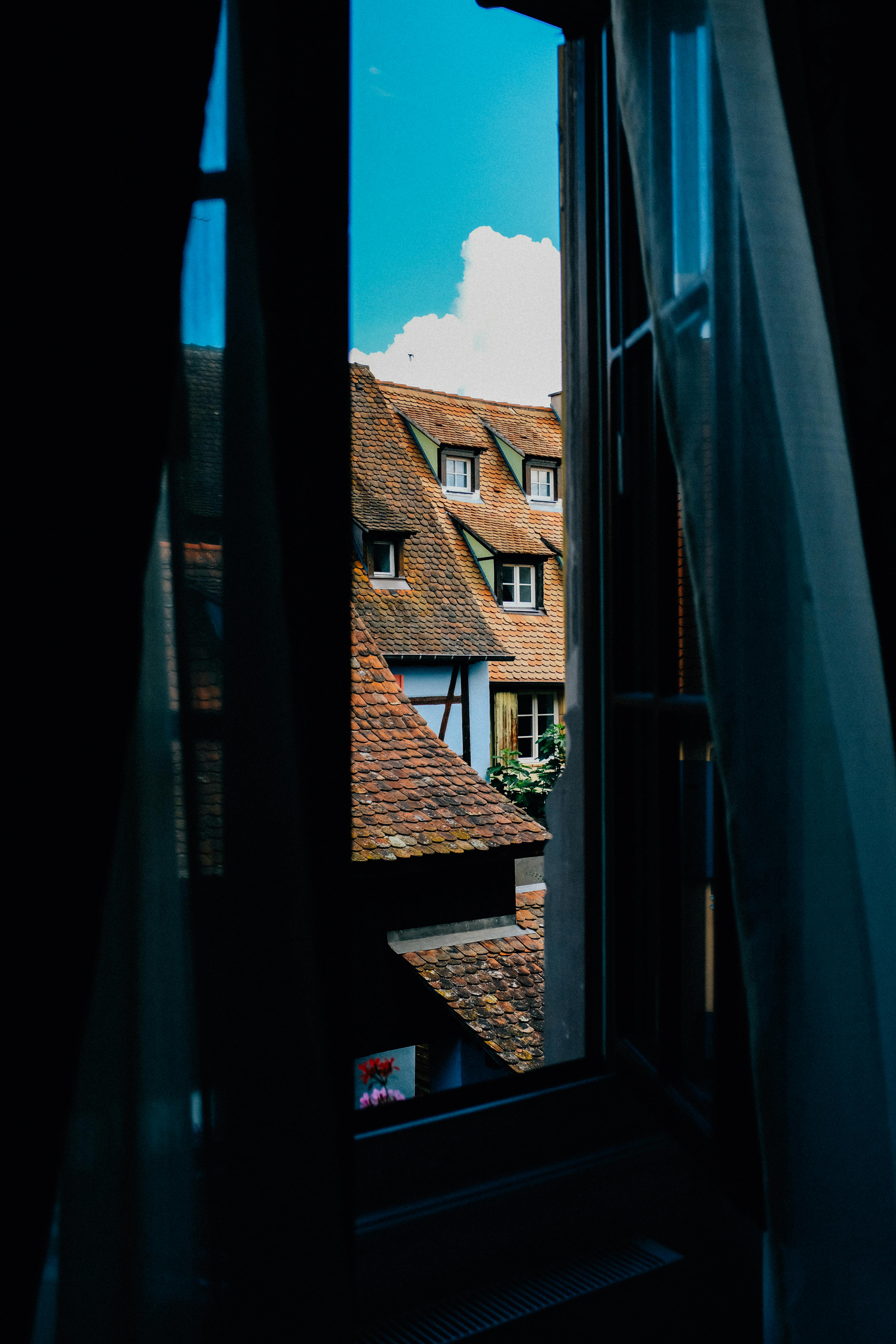 View of houses through open window · Free Stock Photo