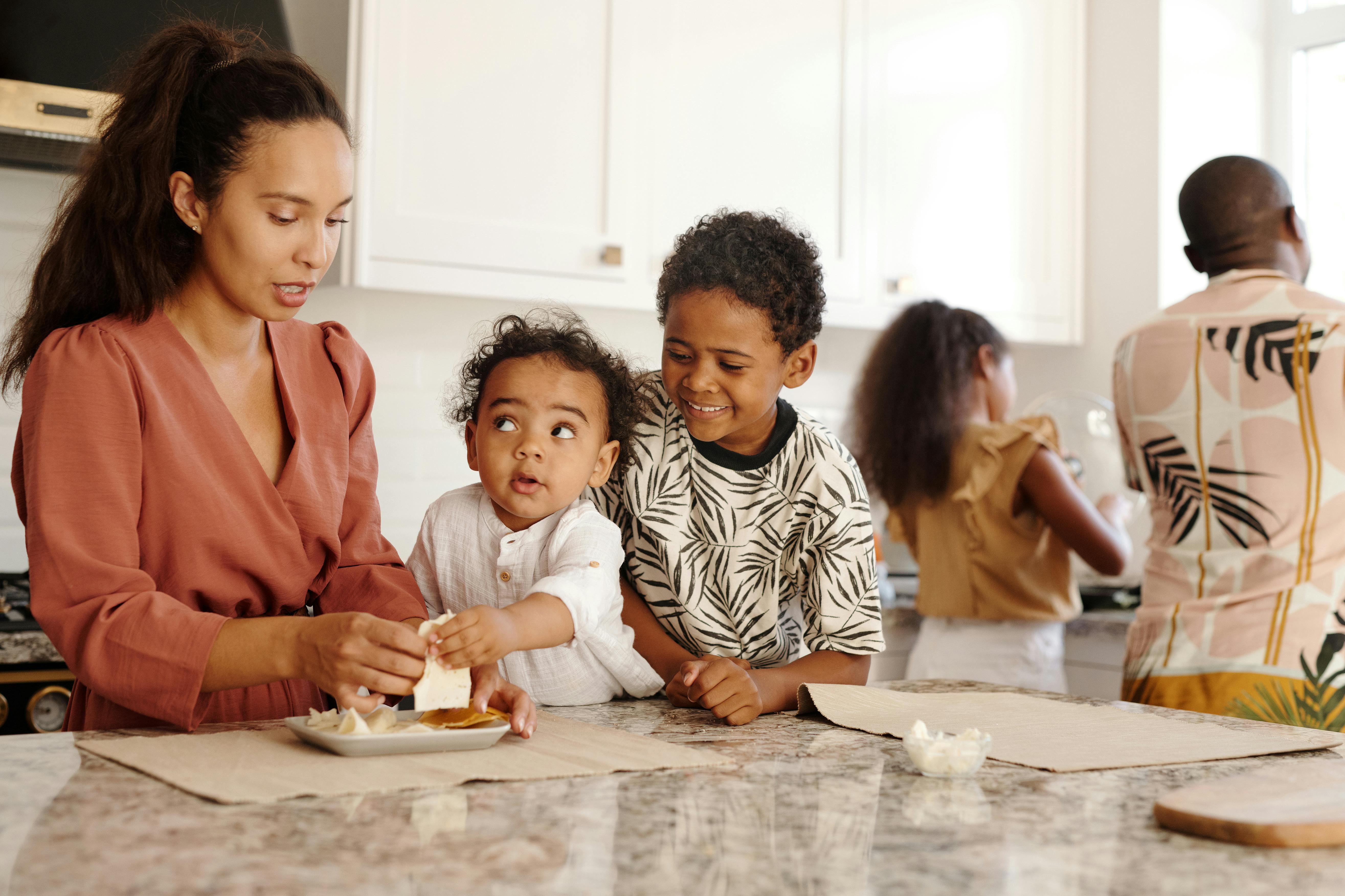Family Making Breakfast in the Kitchen · Free Stock Photo
