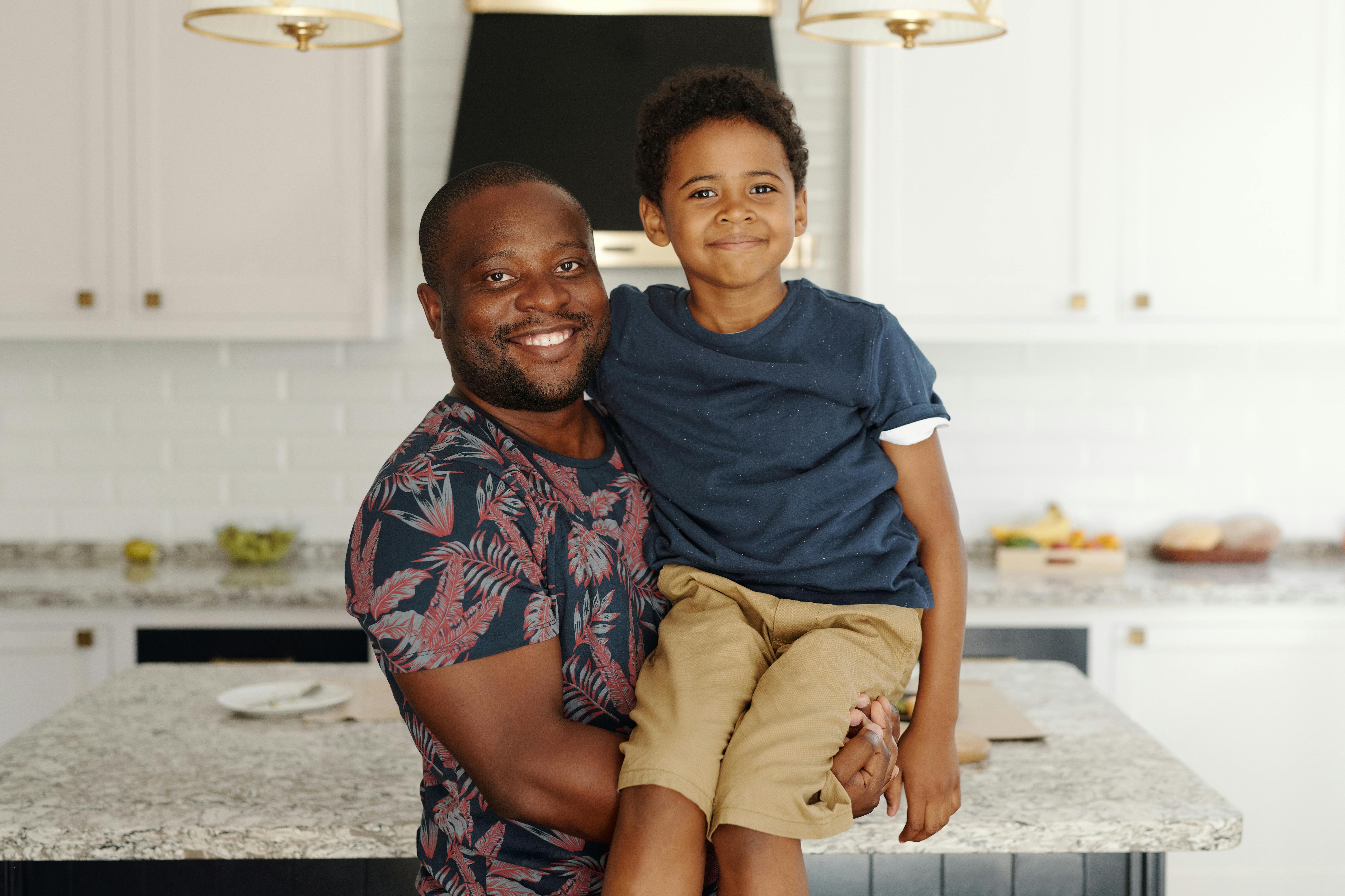Man Carrying a Boy · Free Stock Photo