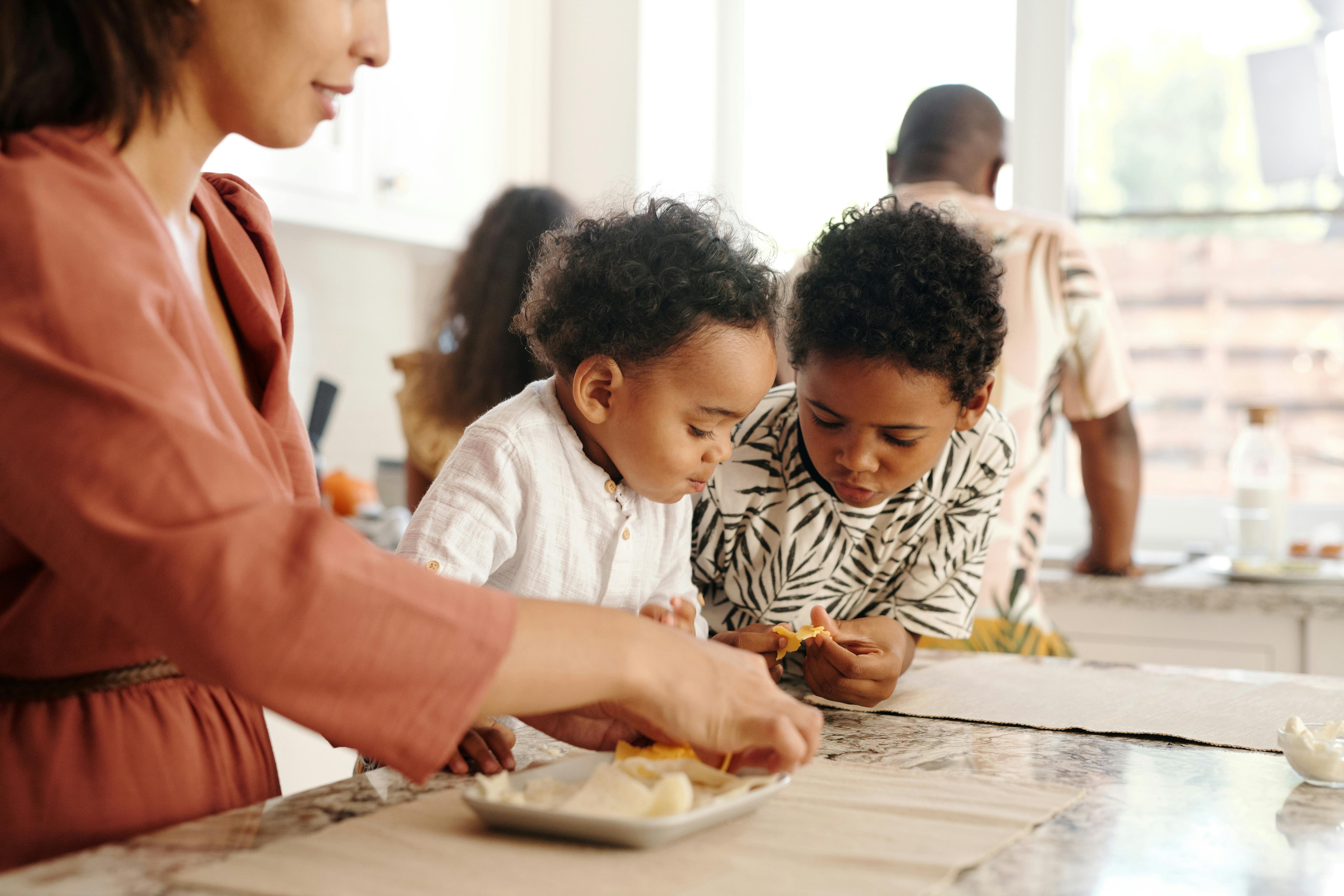 Family Making Breakfast in the Kitchen · Free Stock Photo