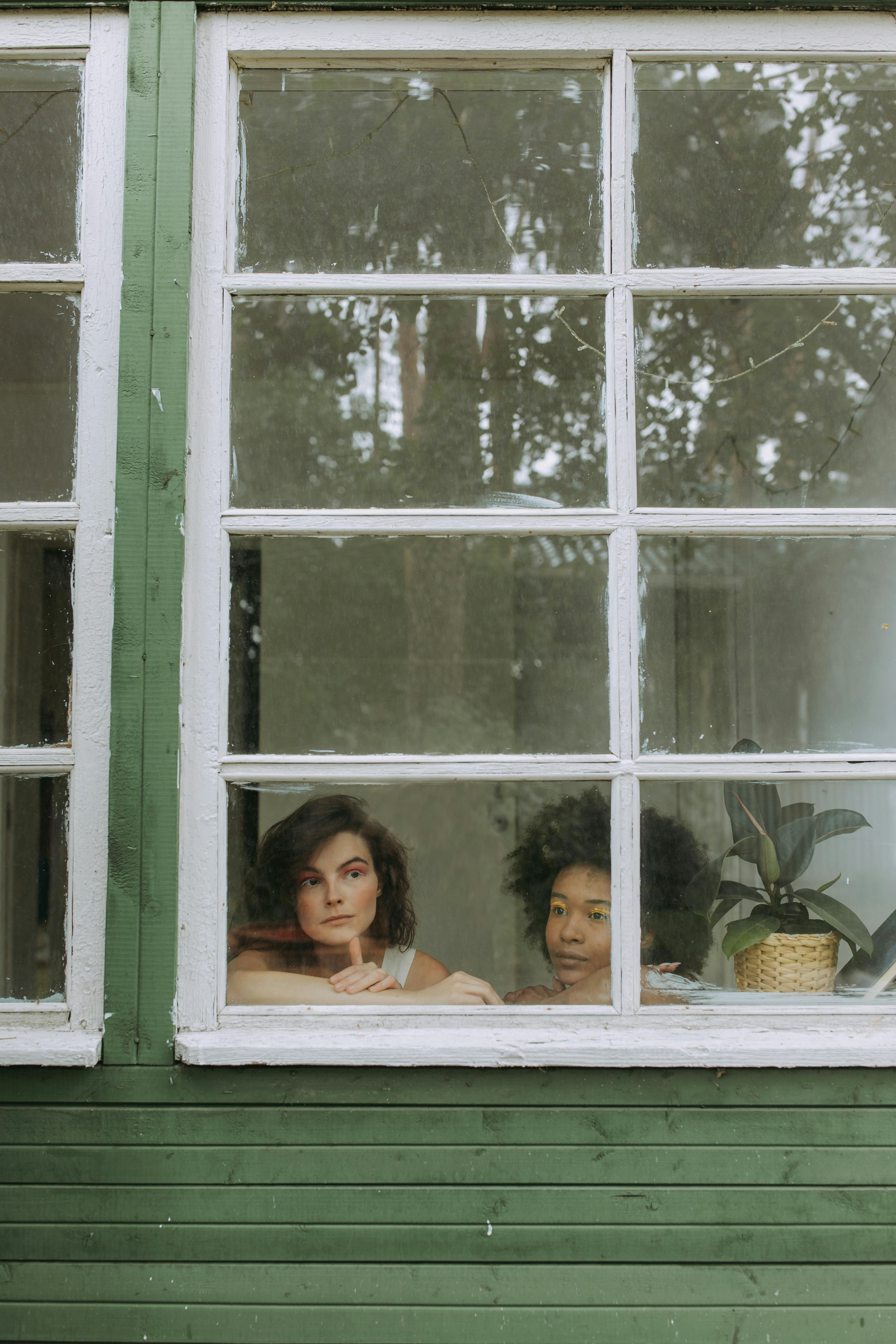 Woman in White Dress Sitting Beside Window · Free Stock Photo