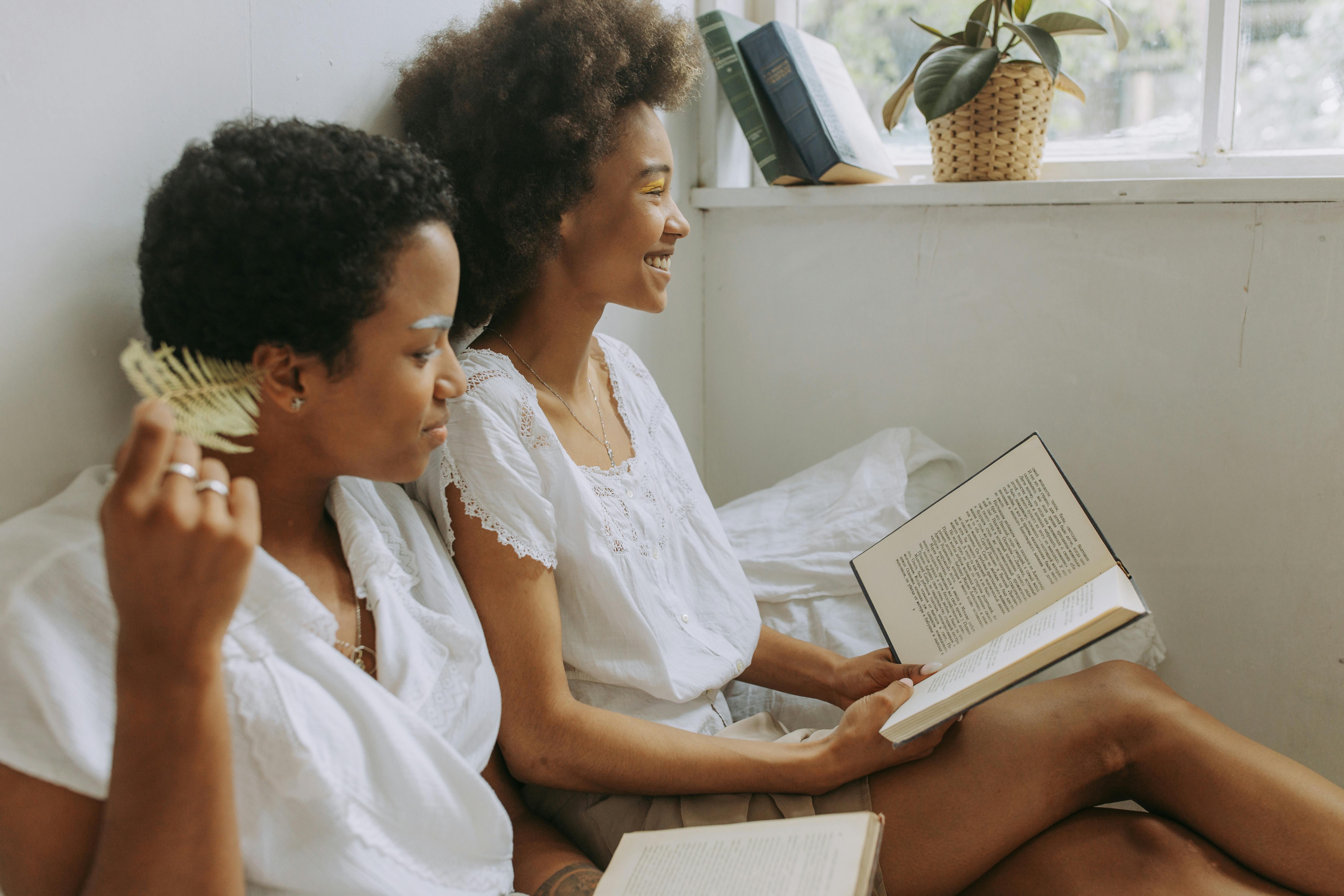\Women in White Dress Reading Books · Free Stock Photo