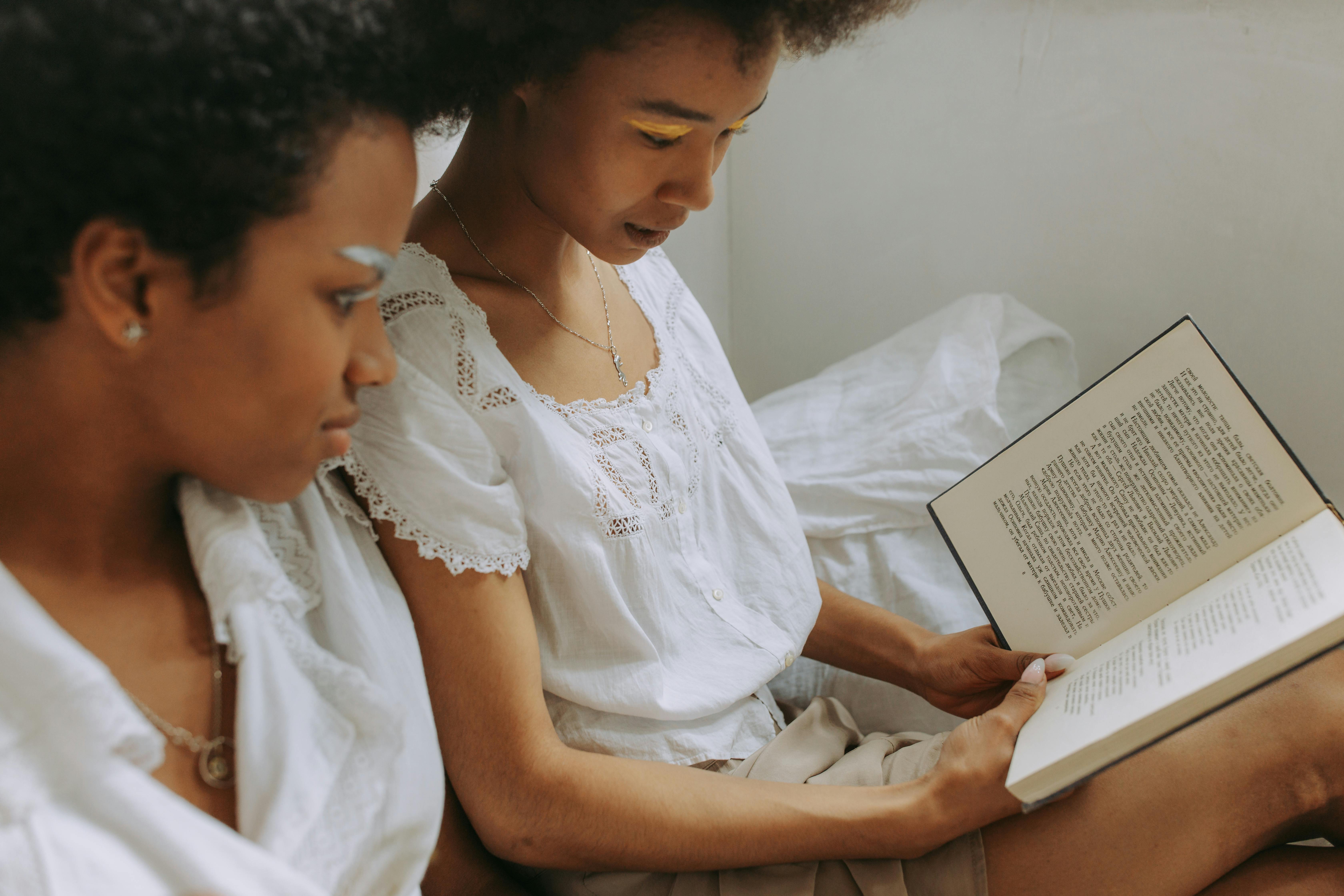 Women in White Dresses Reading a Book · Free Stock Photo