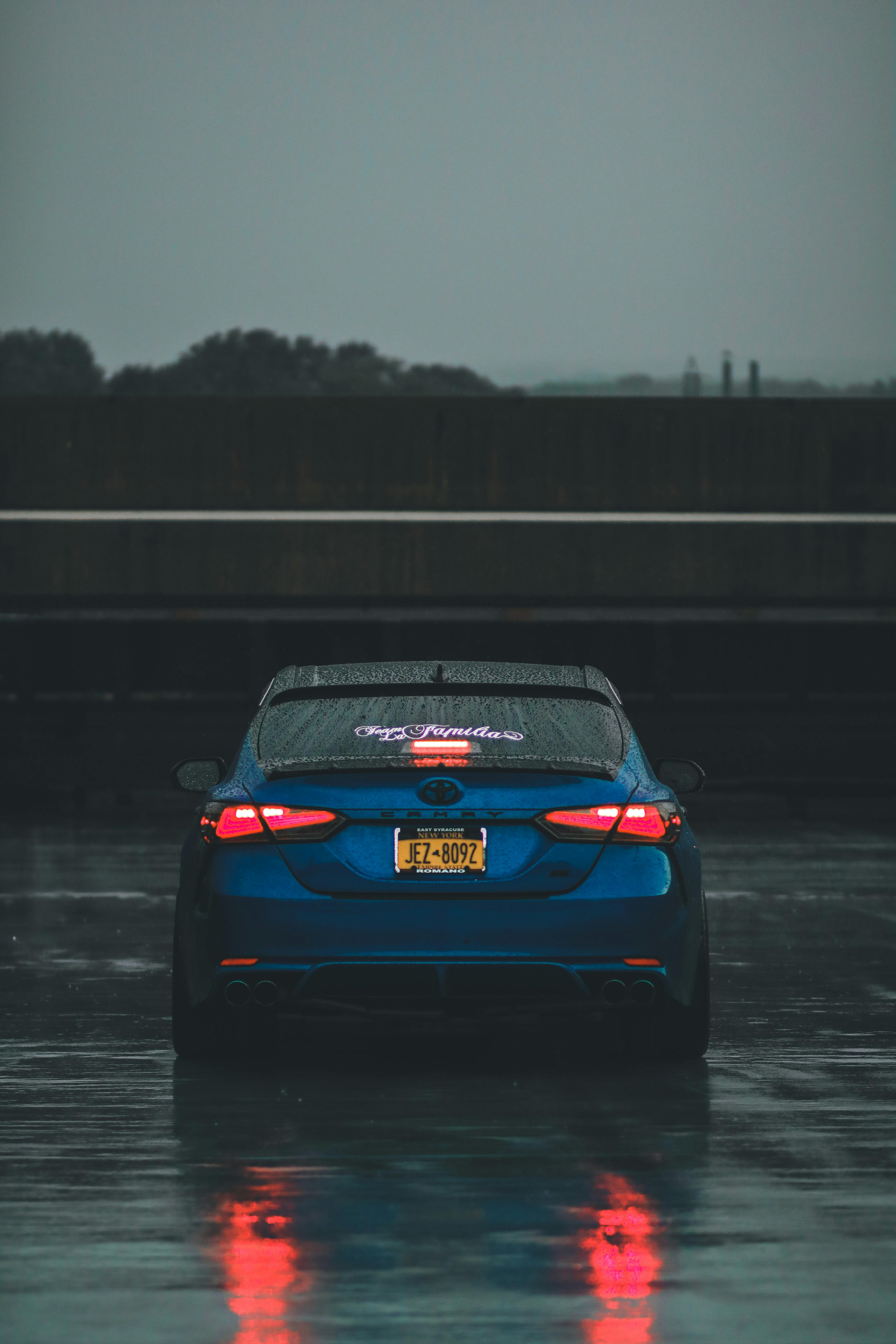 Blue Car on Rainy Night · Free Stock Photo
