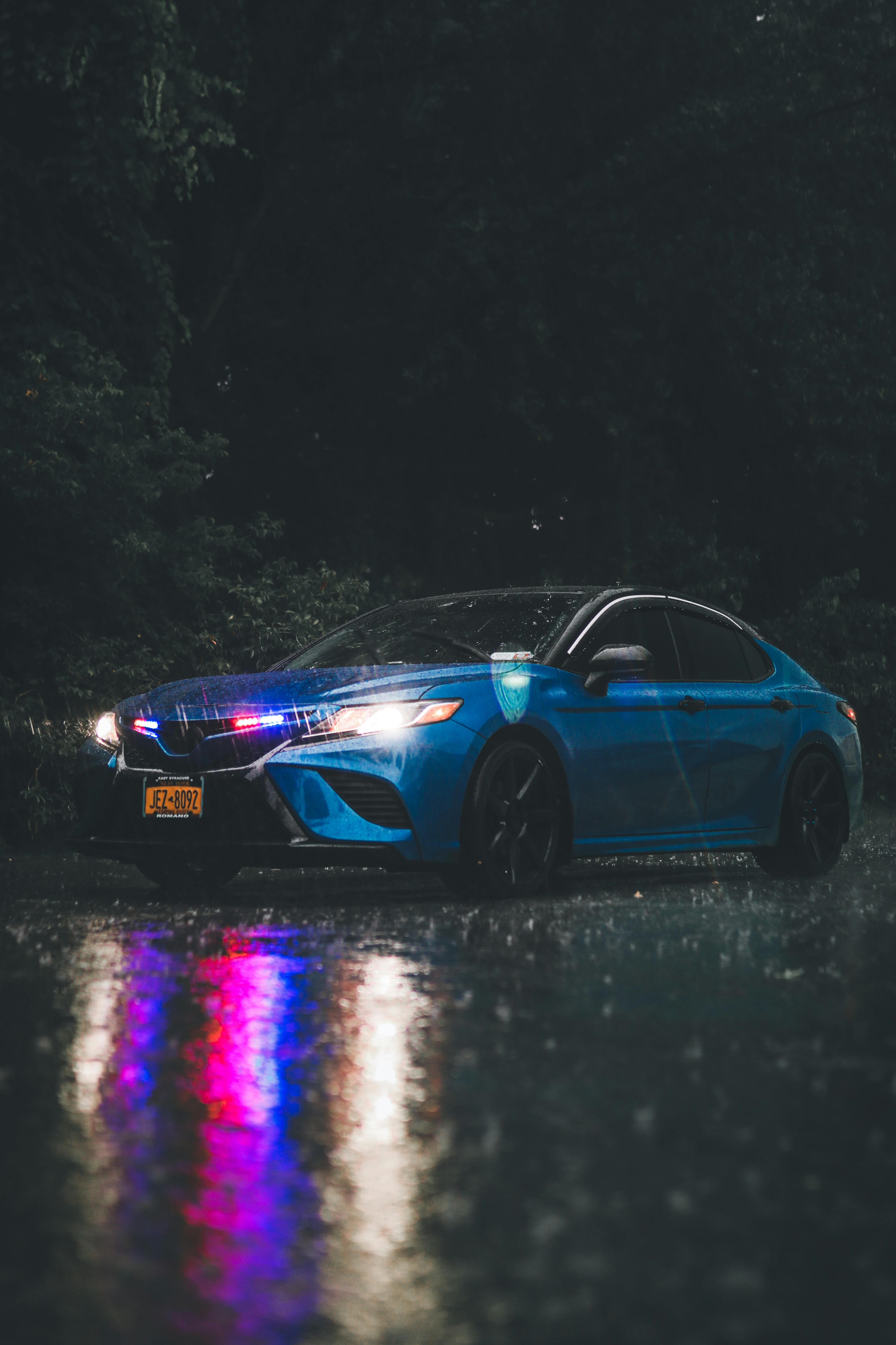Blue Car on Rainy Night · Free Stock Photo