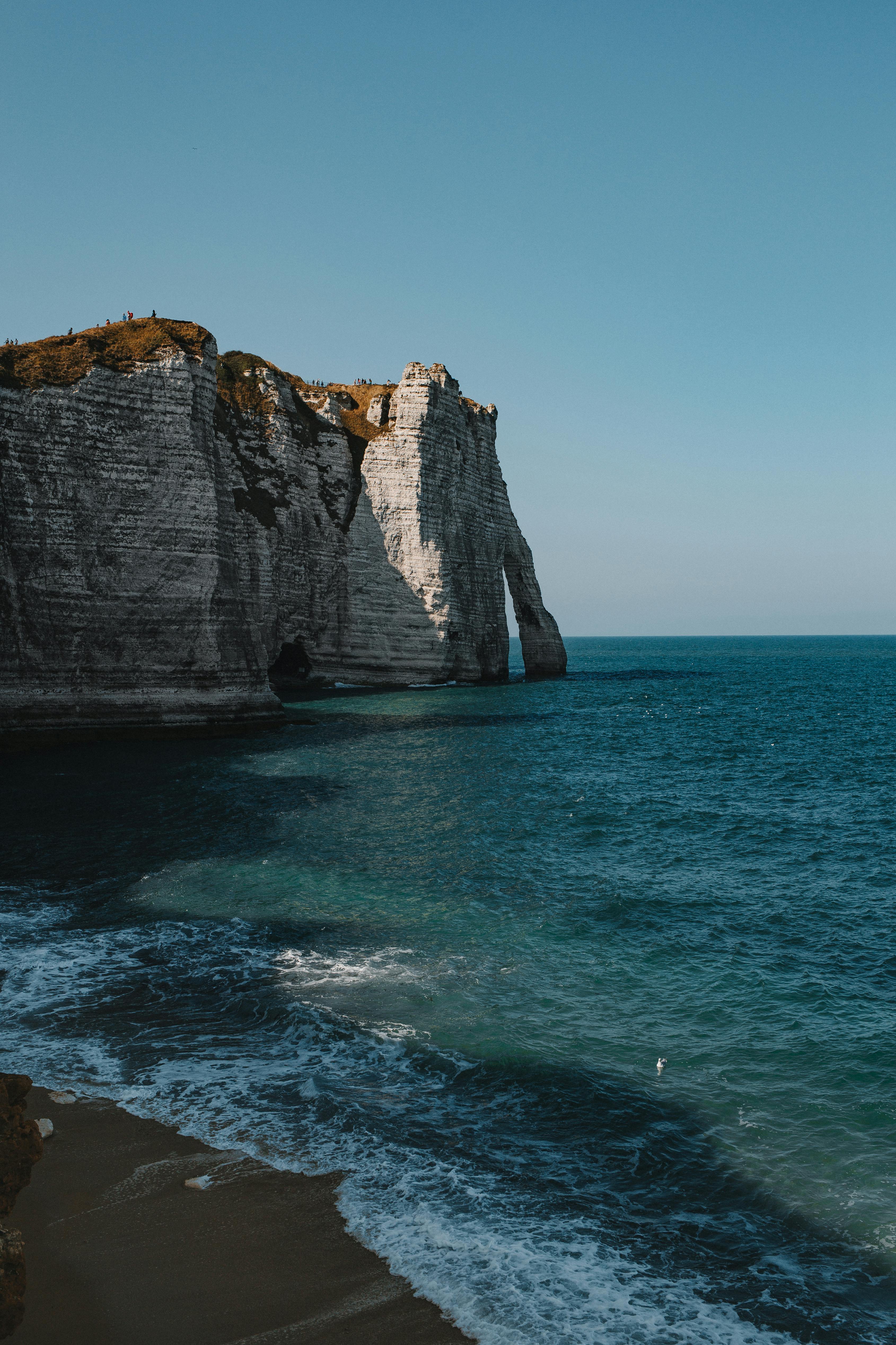 Rock Cliff Near Seashore · Free Stock Photo