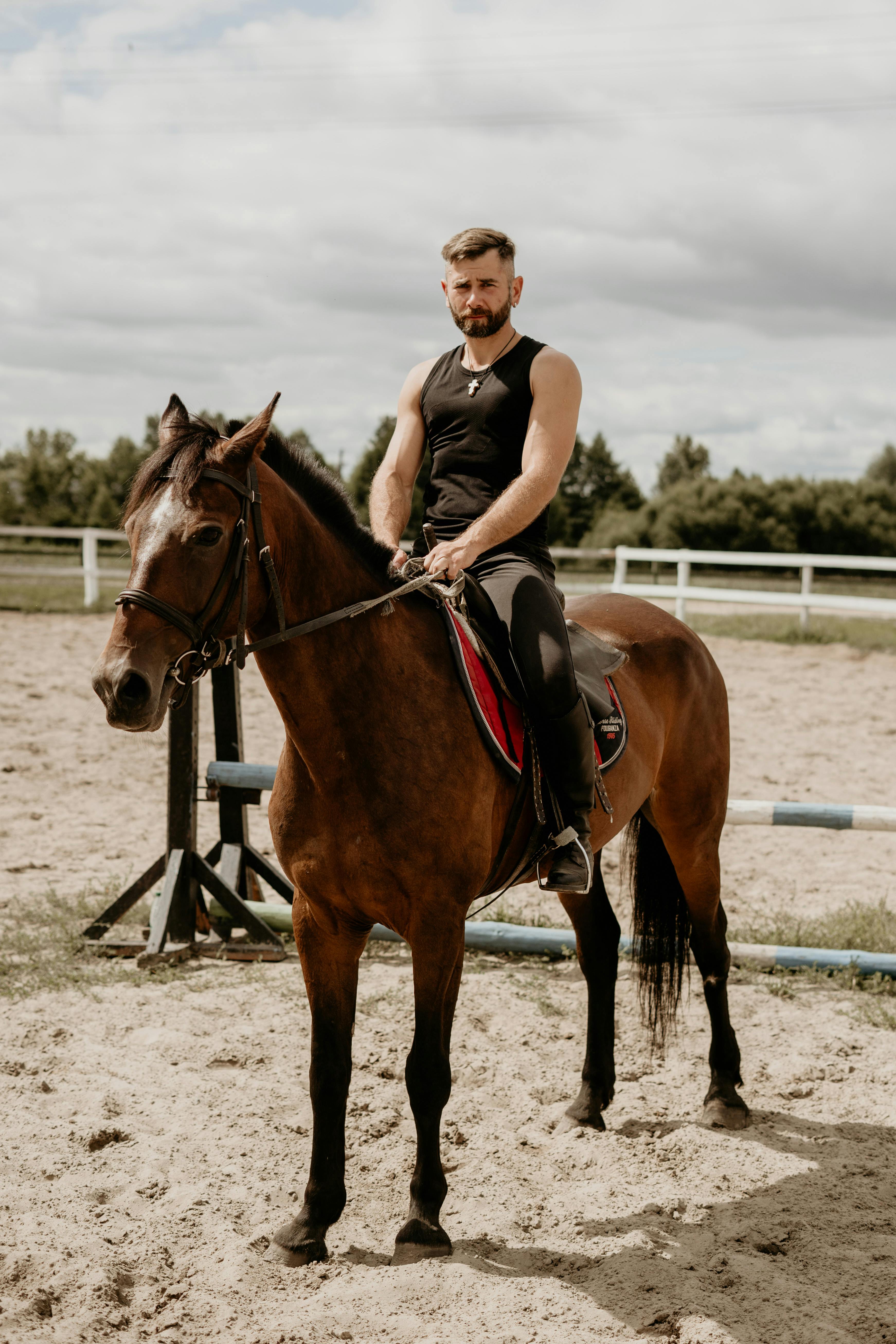 A Man Riding a Brown Horse · Free Stock Photo