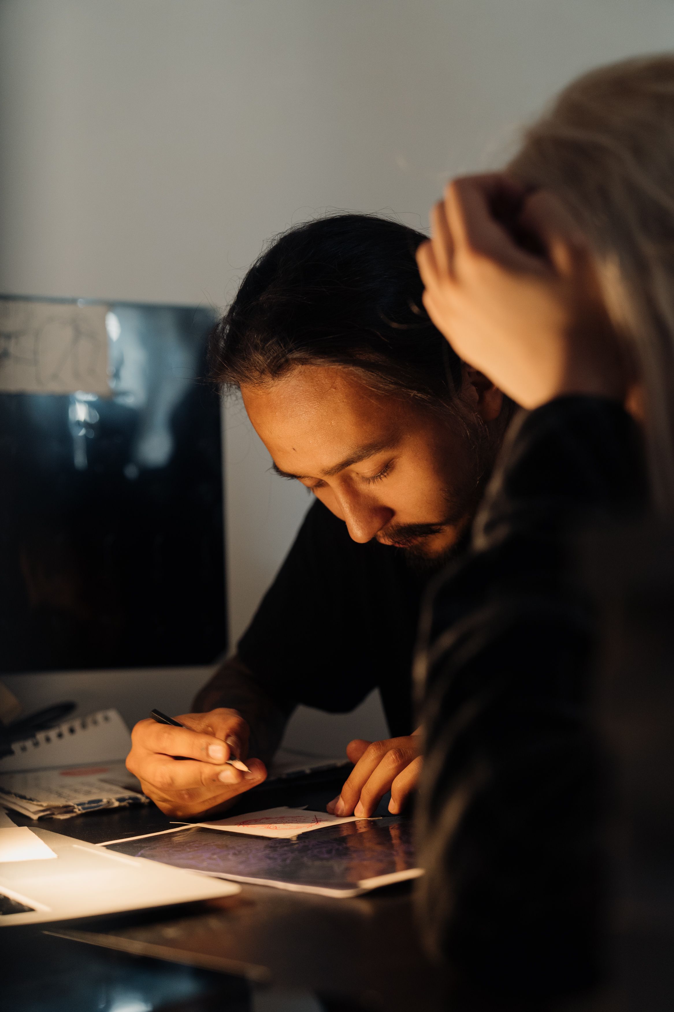 Close-Up Shot of a Man Drawing on Paper · Free Stock Photo