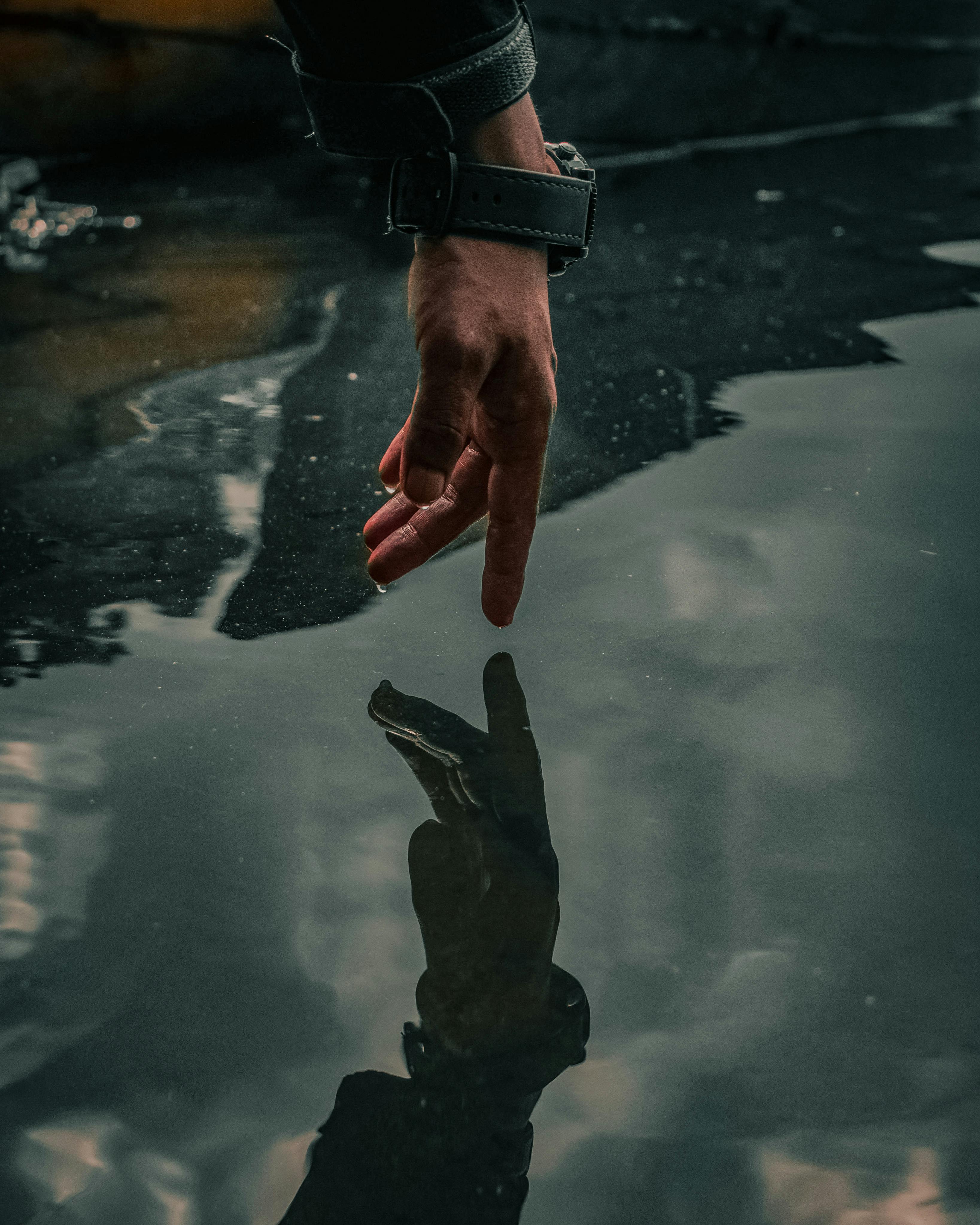 Hand Touching Surface of Mirror · Free Stock Photo