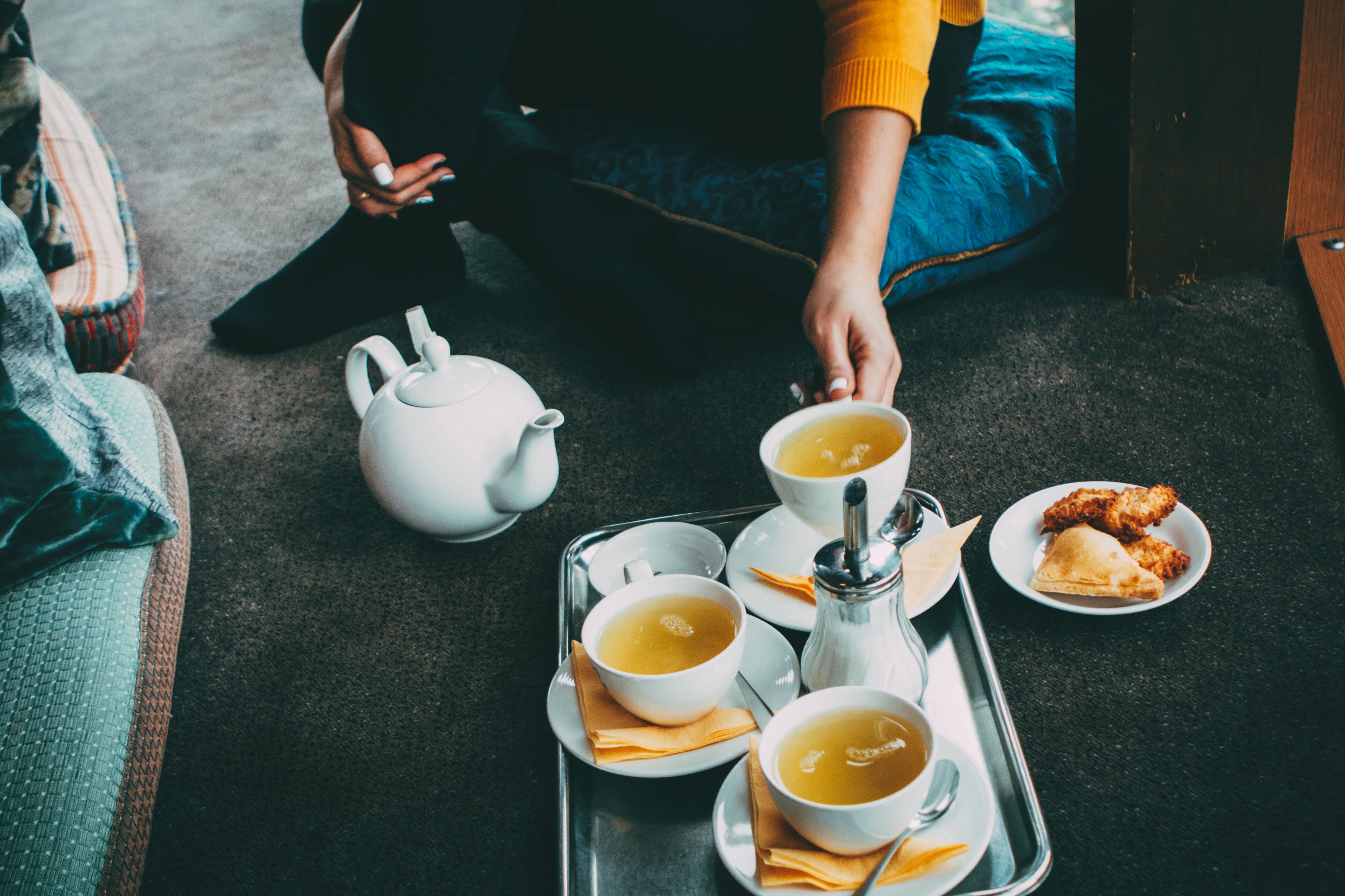Person Holding a Cup of tea · Free Stock Photo