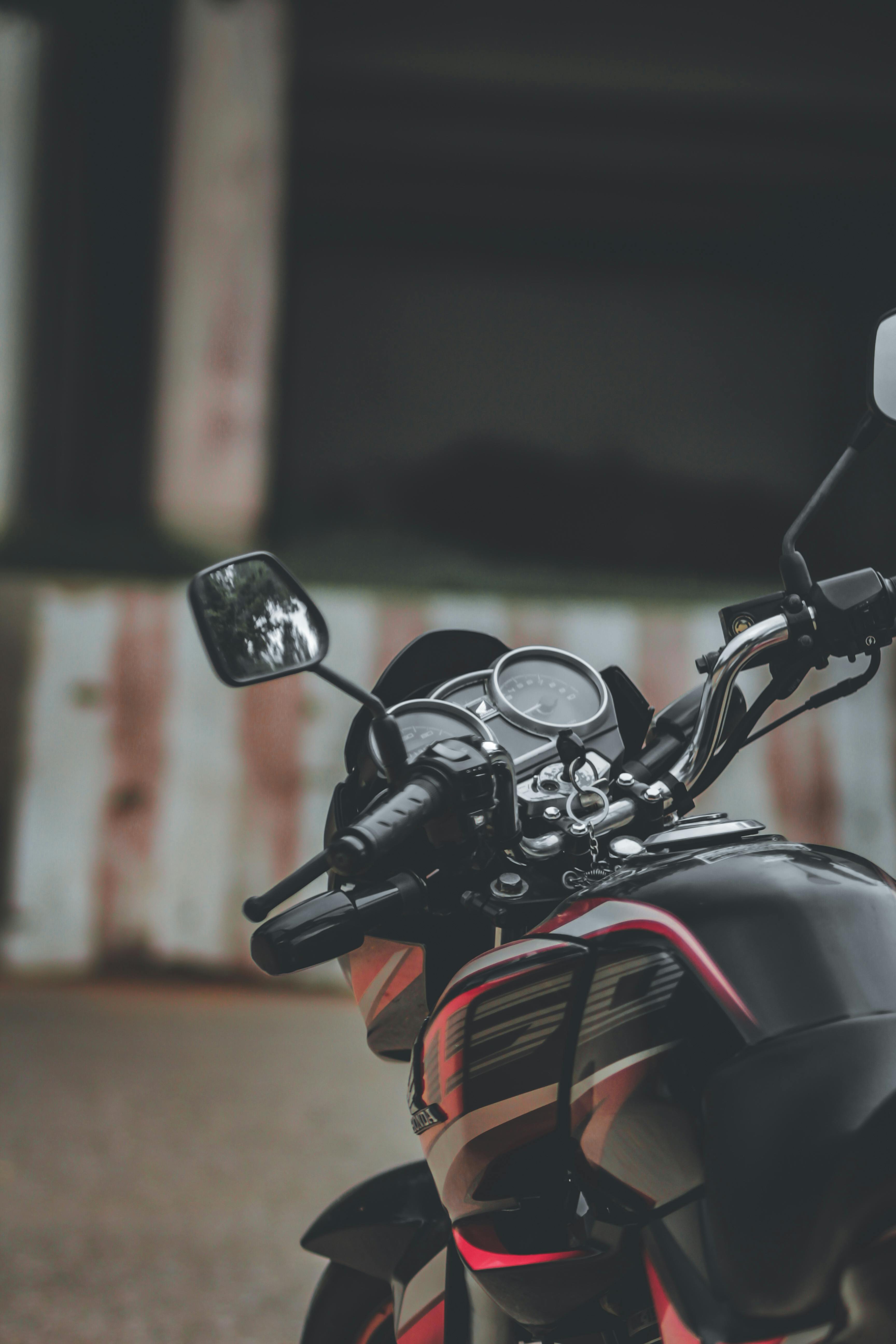 White and Black Suzuki Motorcycle on Sand · Free Stock Photo