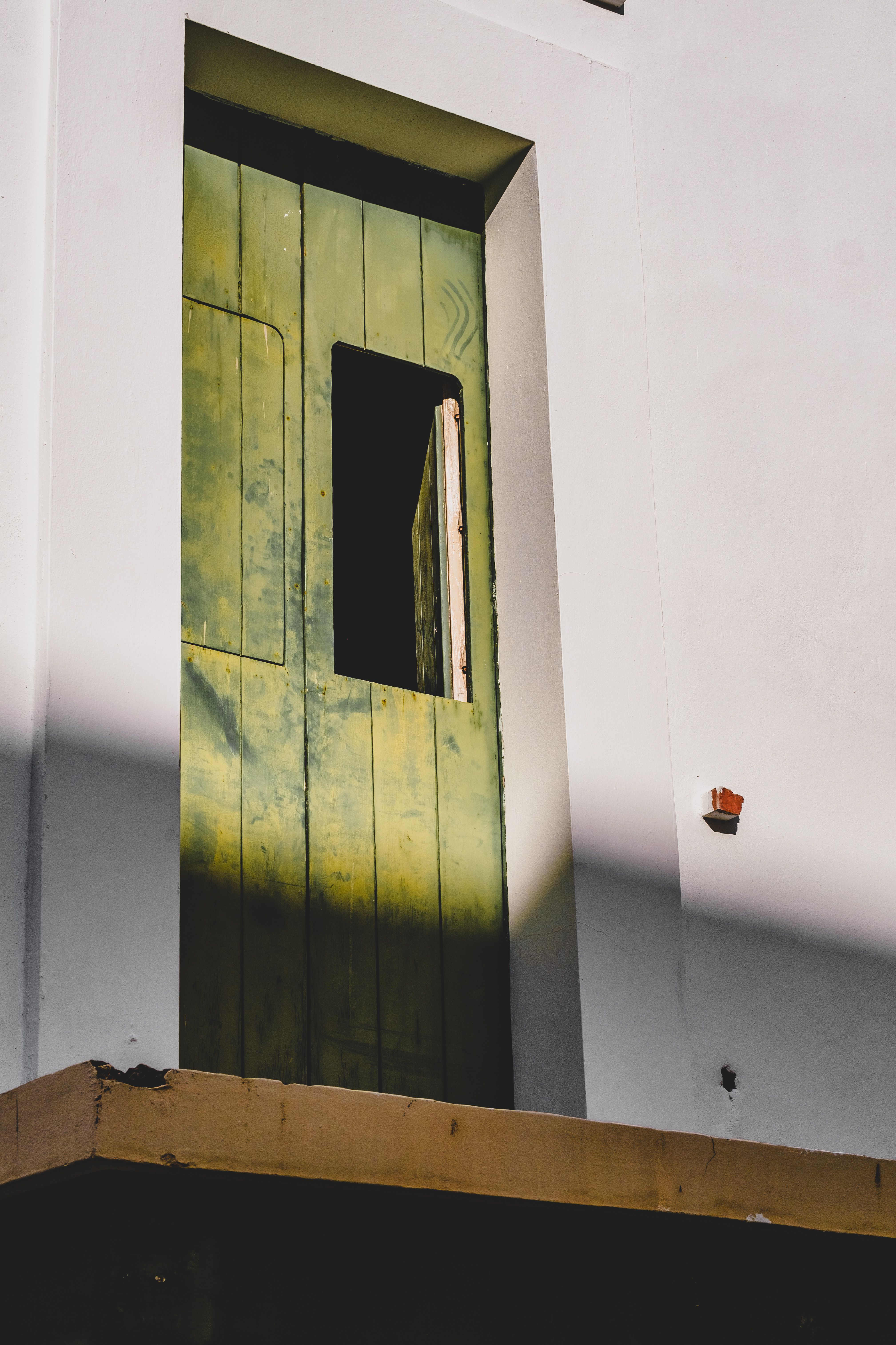 Low Angle Shot of Green Wooden Door · Free Stock Photo
