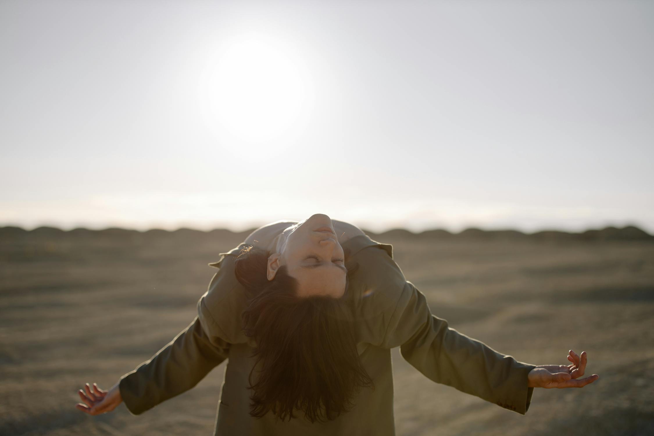 Woman in Brown Jacket Standing on Field · Free Stock Photo Woman in Brown Jacket Standing on Field · Free Stock Photo