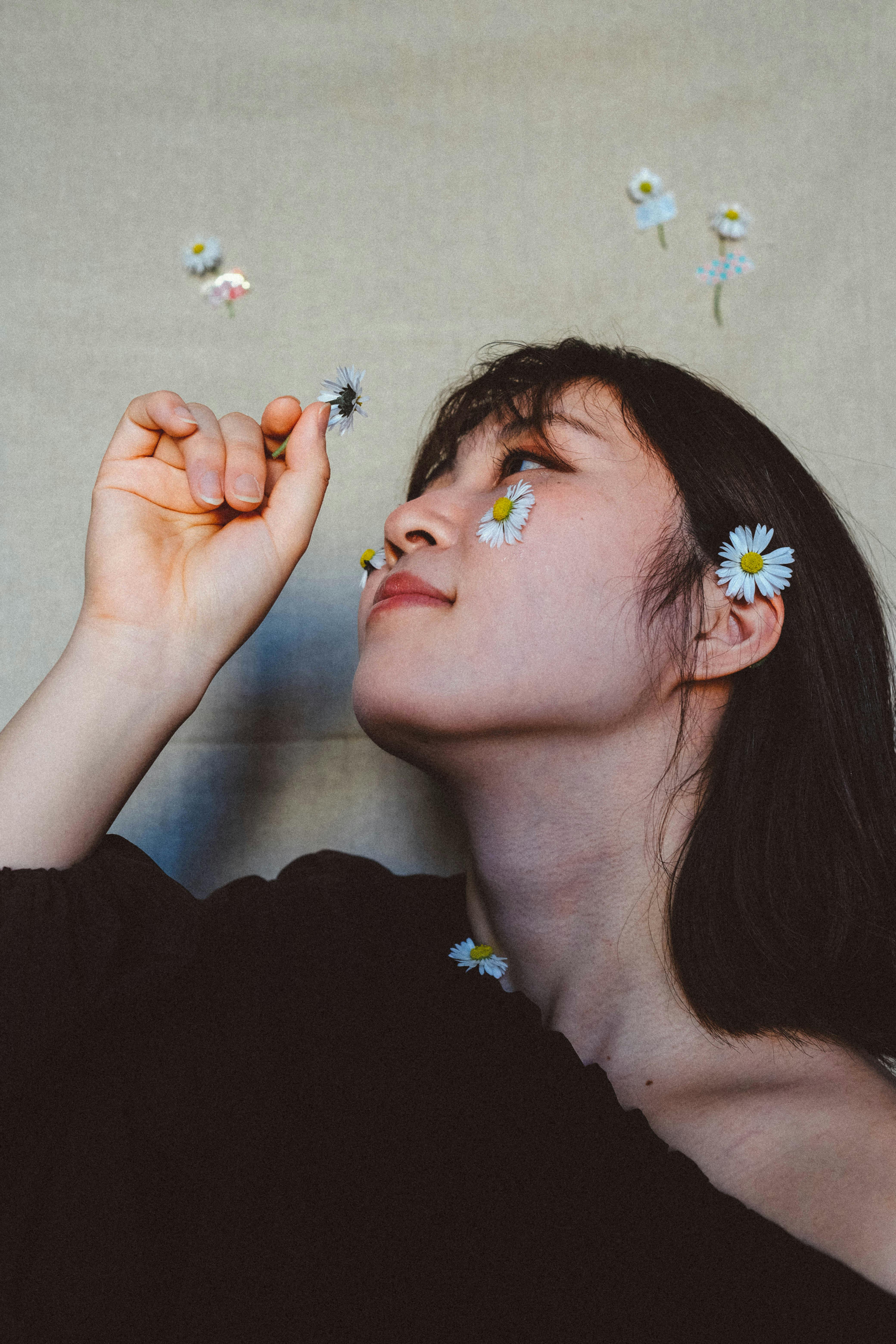 A Young Woman Looking at a Flower · Free Stock Photo
