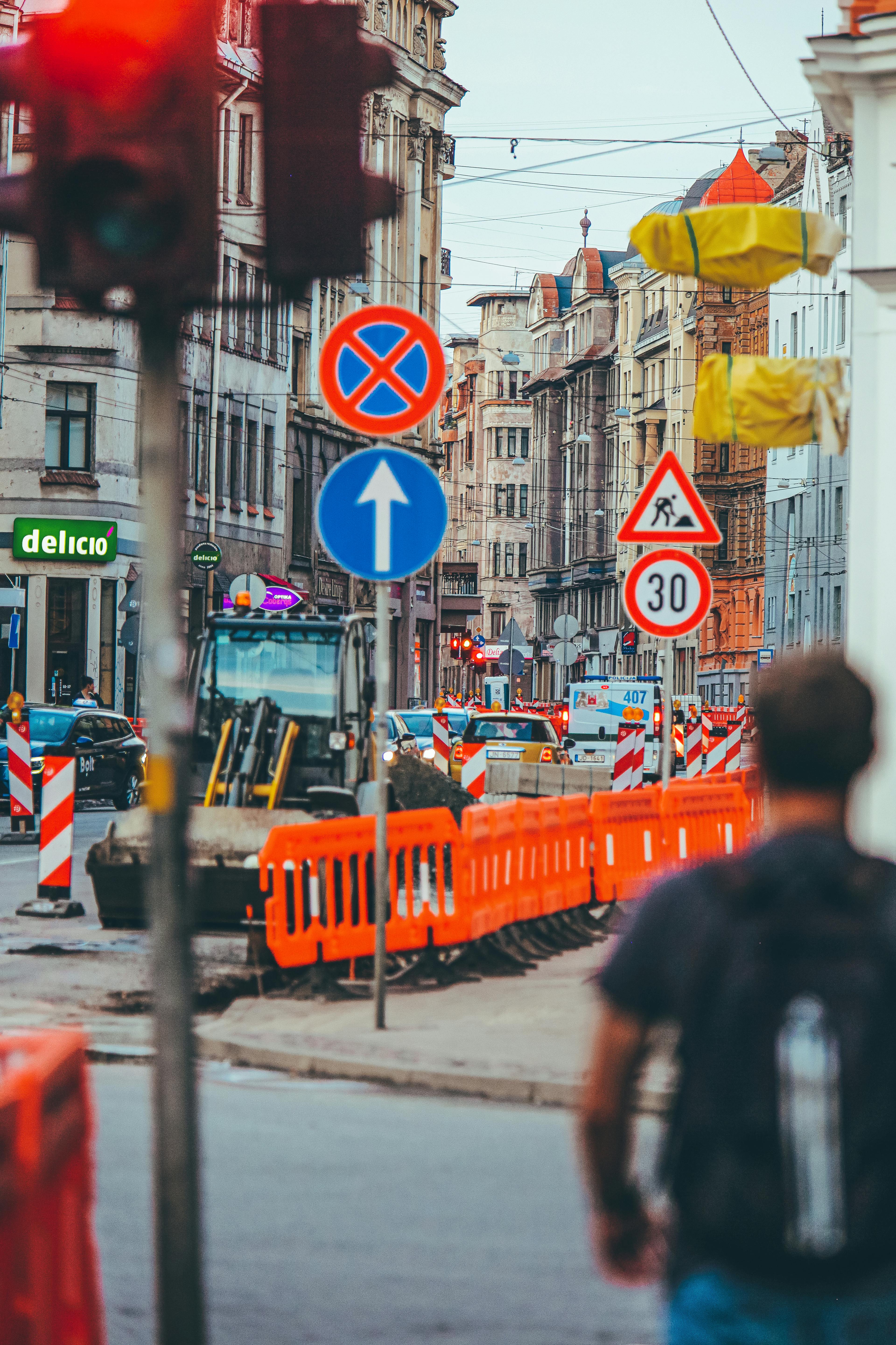 Directional Signages in a City Sidewalk · Free Stock Photo