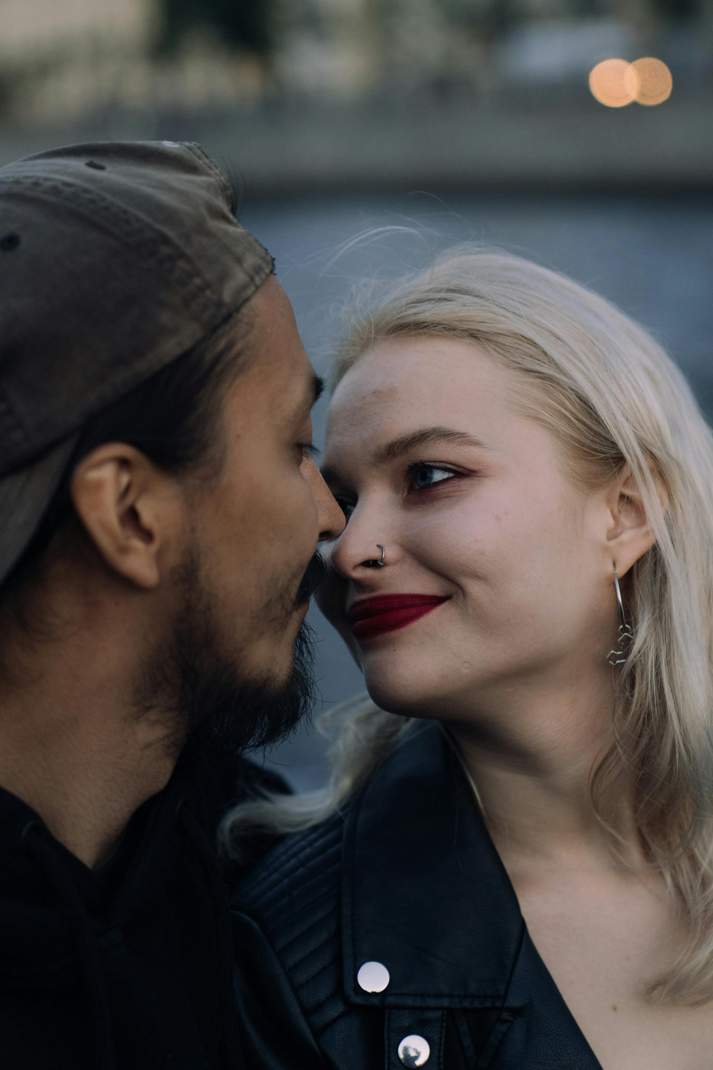 Woman Pinching her Boyfriends Cheek · Free Stock Photo