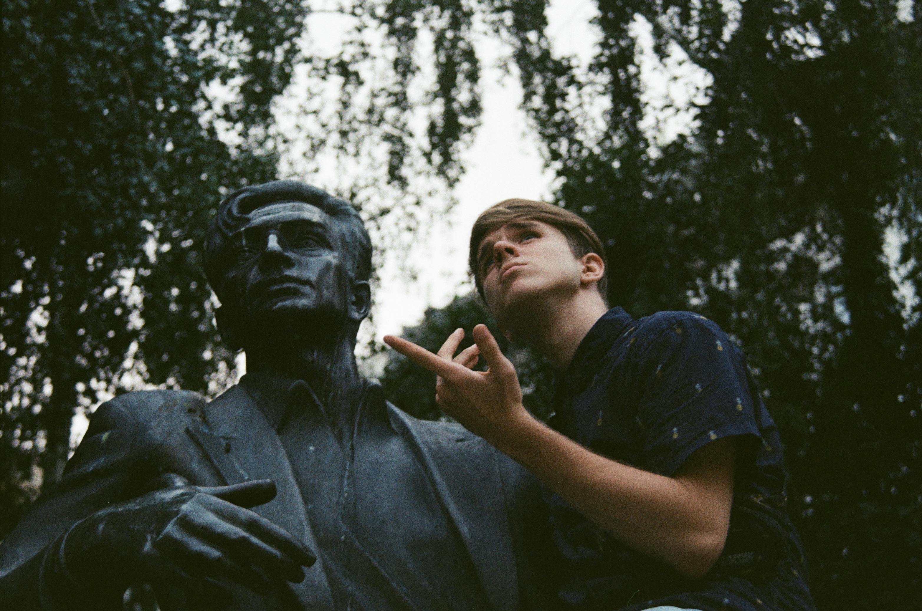 Low Angle Shot of Man Looking on Night Sky · Free Stock Photo