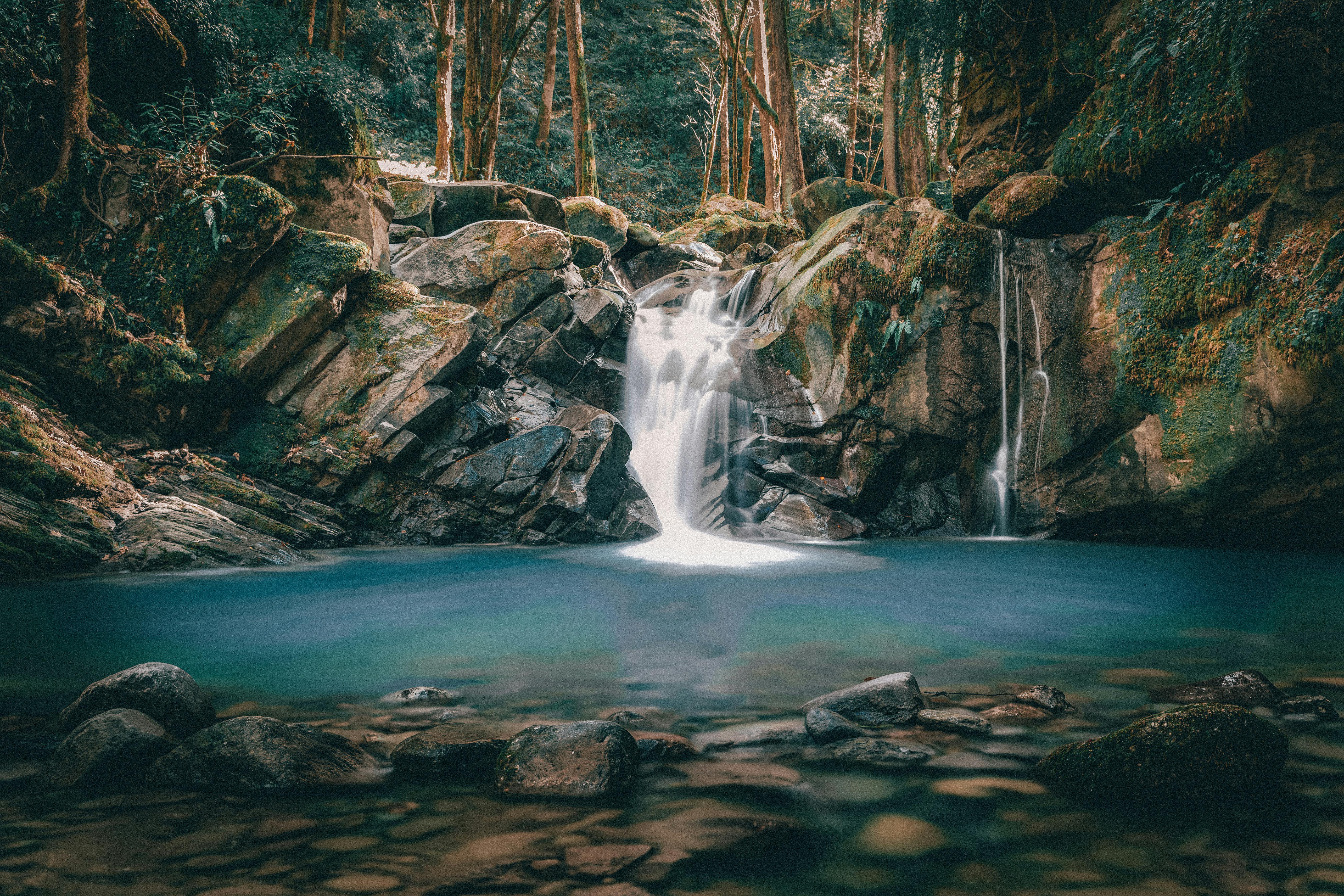 Waterfall in rocky ravine on painted picture · Free Stock Photo