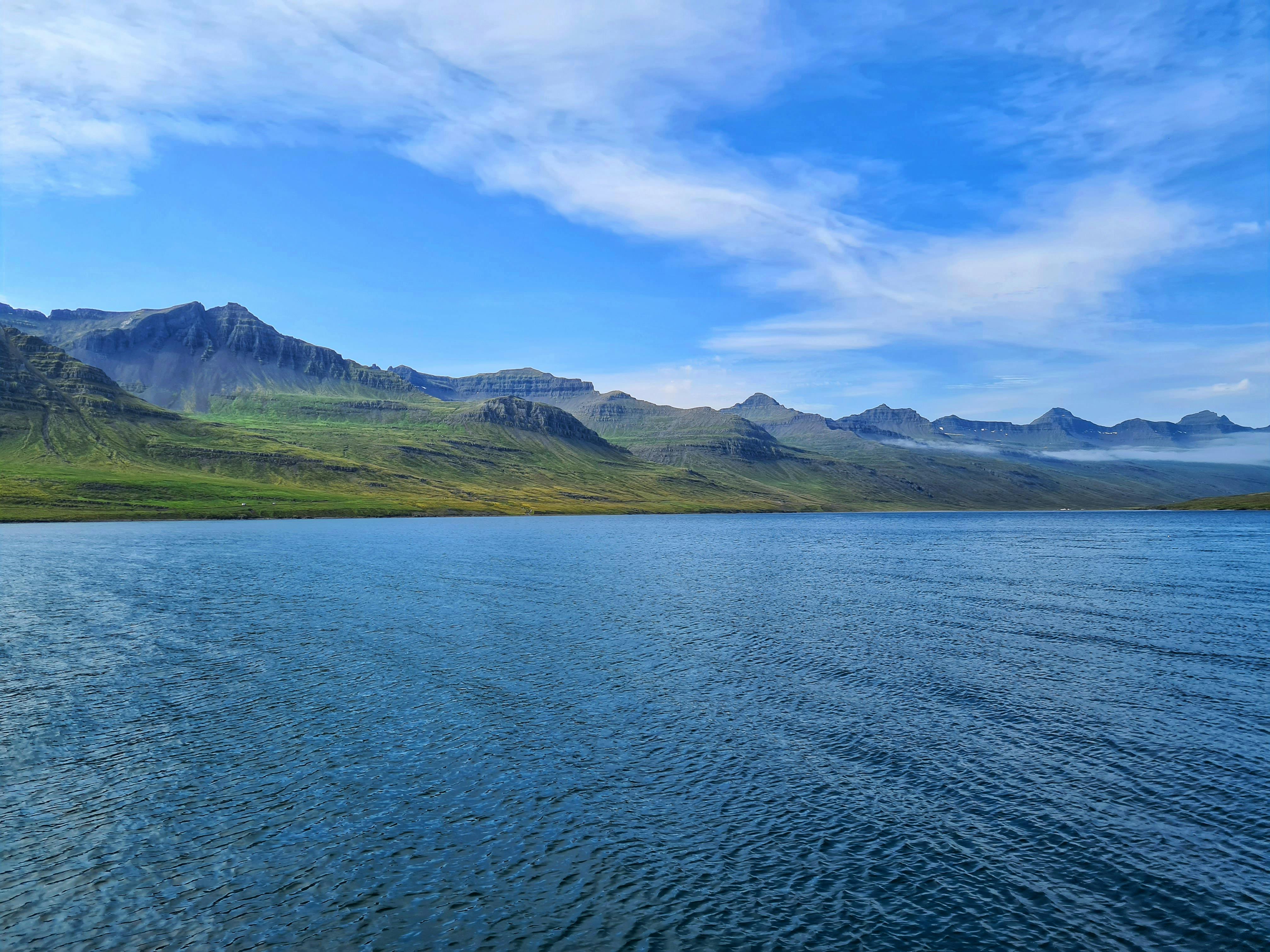 Various rocky formations located in deep sea near mountains · Free ...