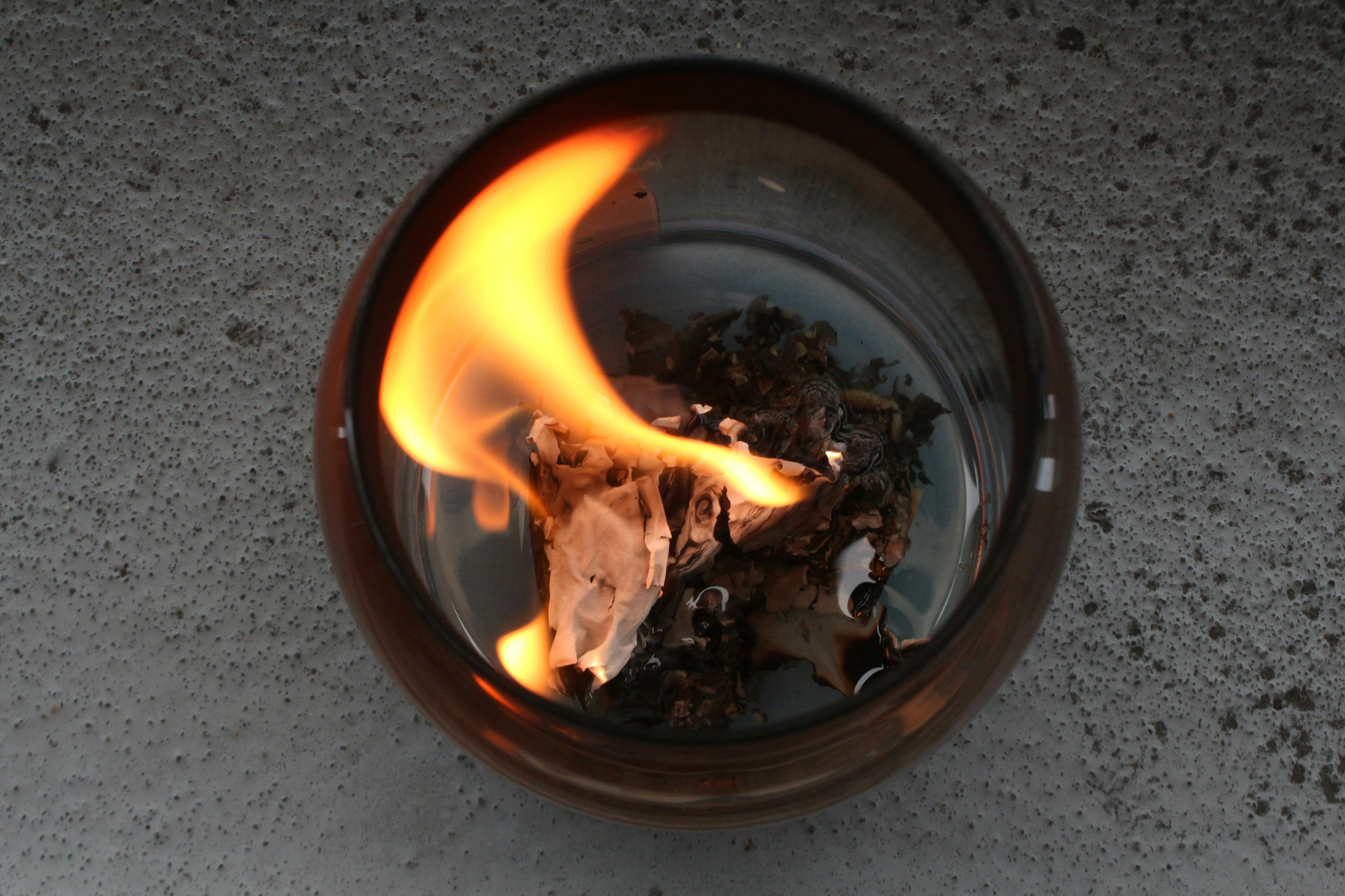Burning Paper on a Glass Container · Free Stock Photo