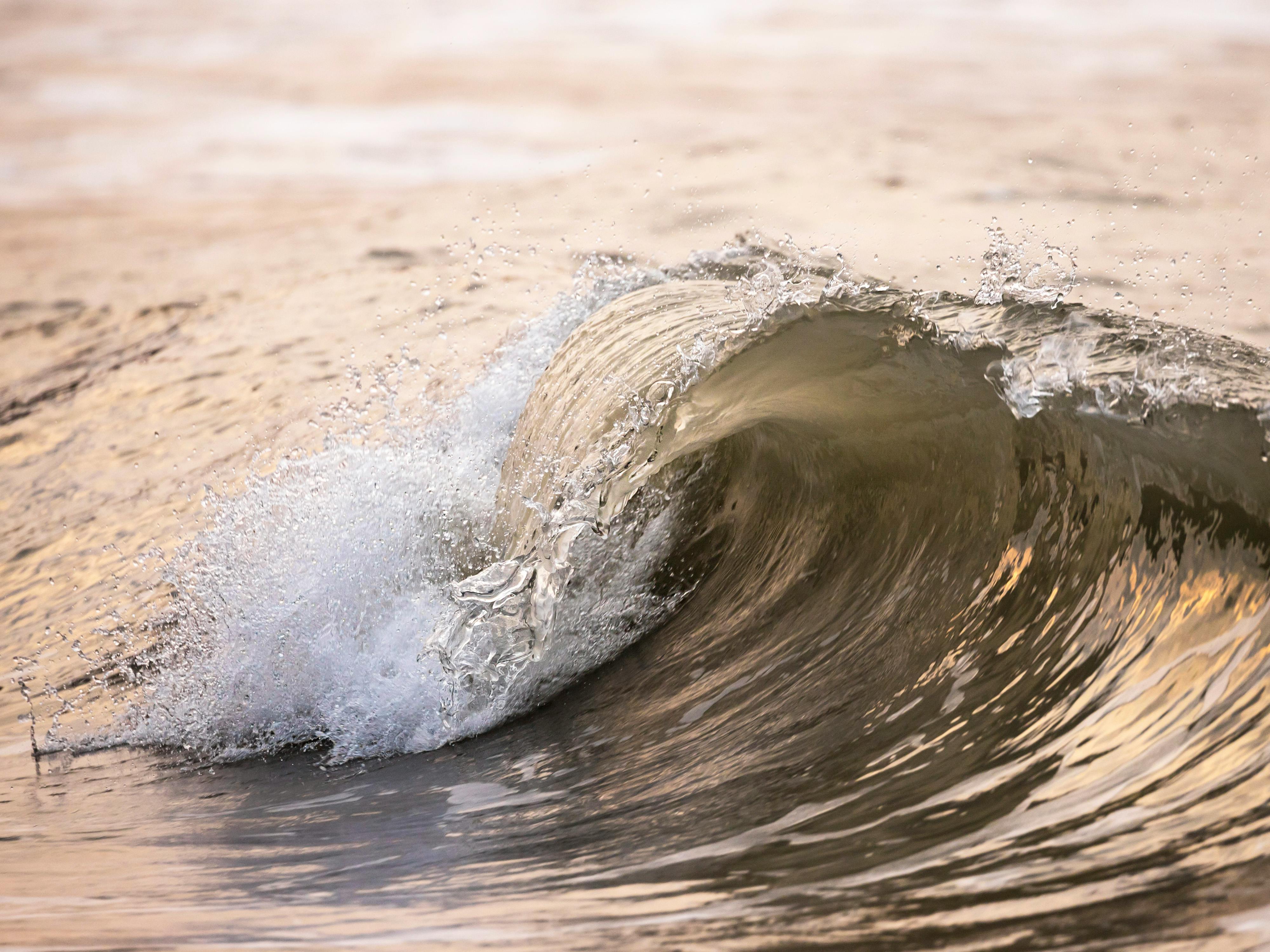 A Close-Up Shot of a Wave Crashing · Free Stock Photo