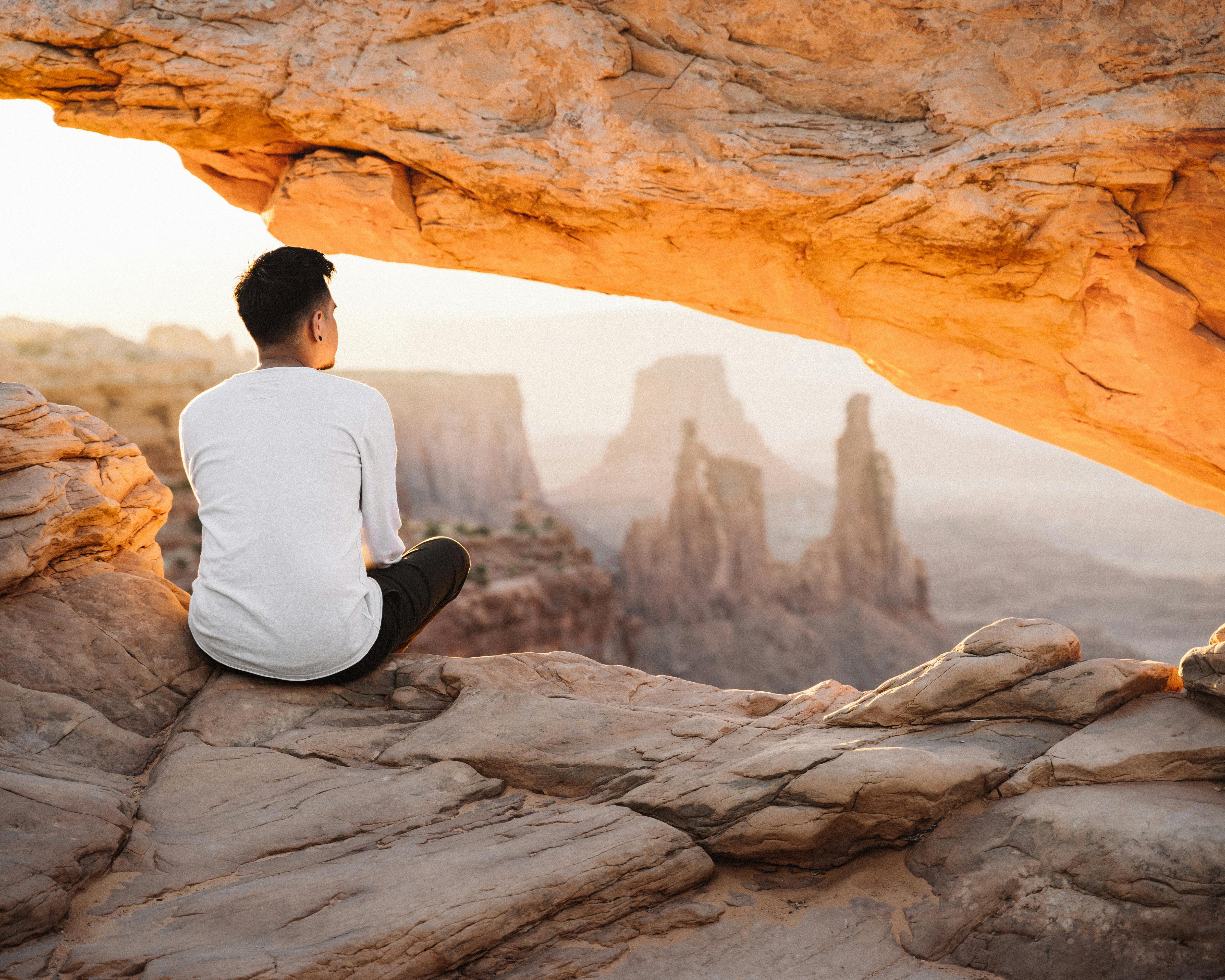 Back View of a Man Sitting on Cliff · Free Stock Photo