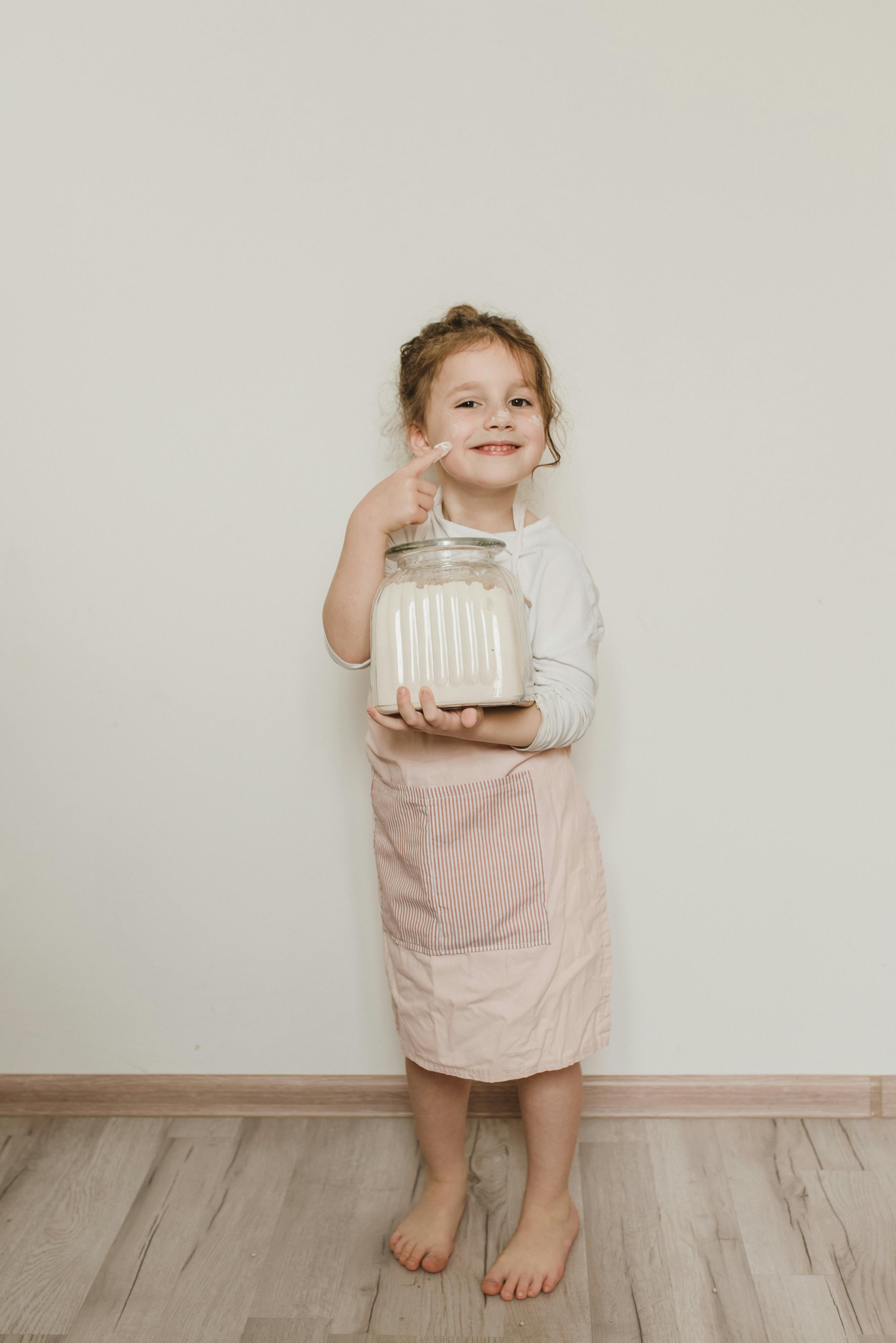 Girl Holding a Jar · Free Stock Photo