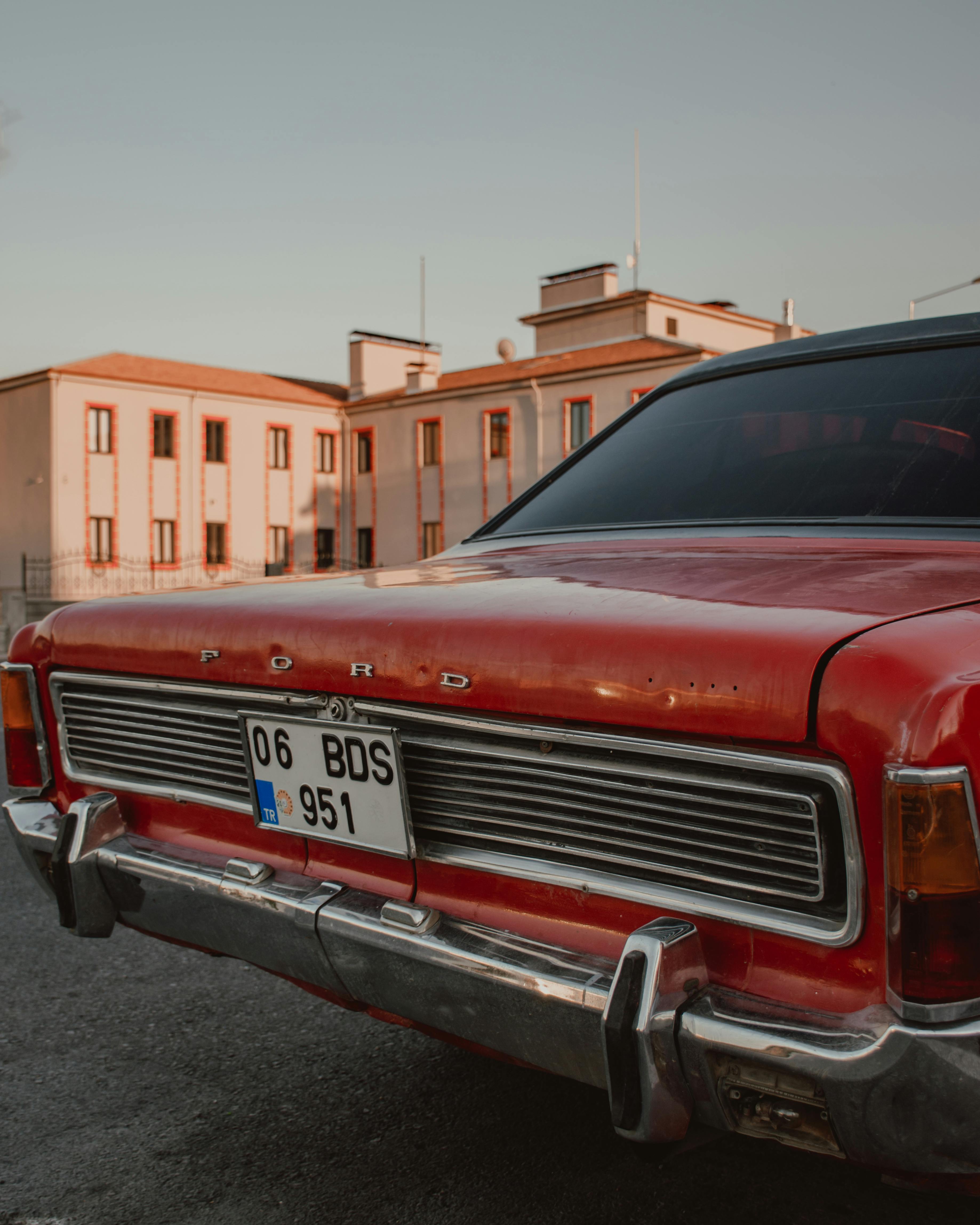 Vintage Red Coupe Parked Beside Gutter · Free Stock Photo