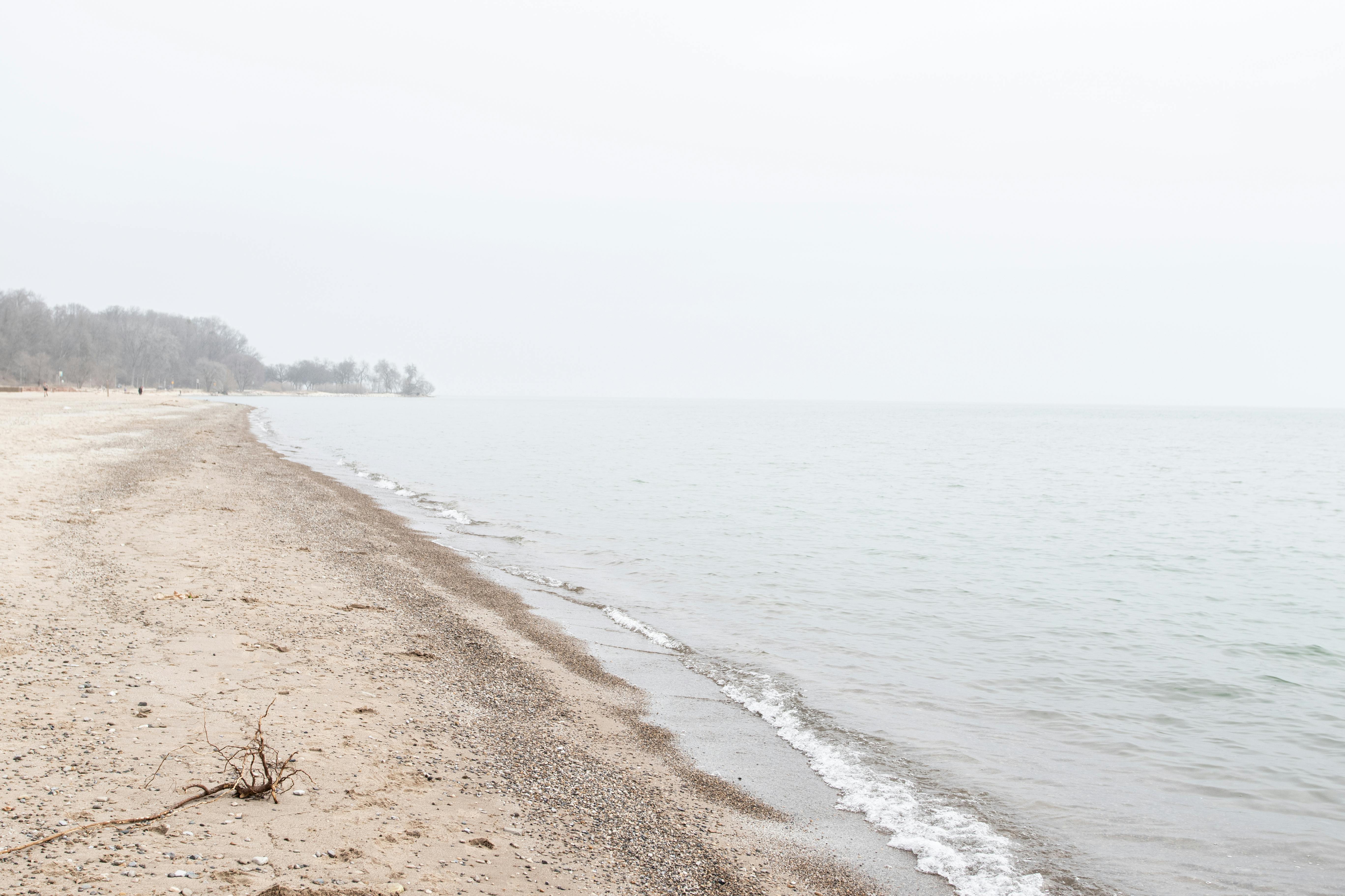 A Calm Waves on the Beach Sand · Free Stock Photo