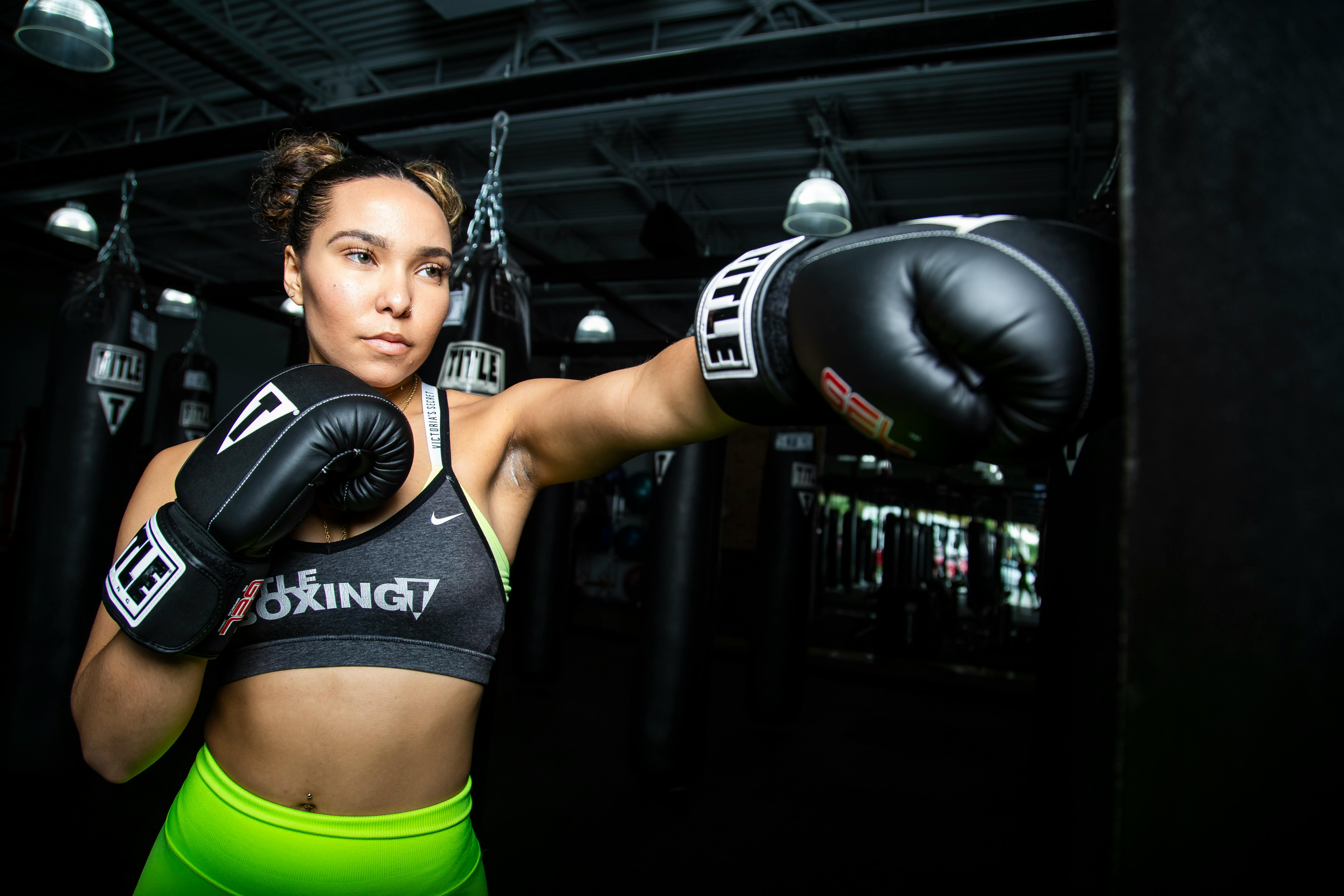 A Woman Wearing Boxing Gloves · Free Stock Photo