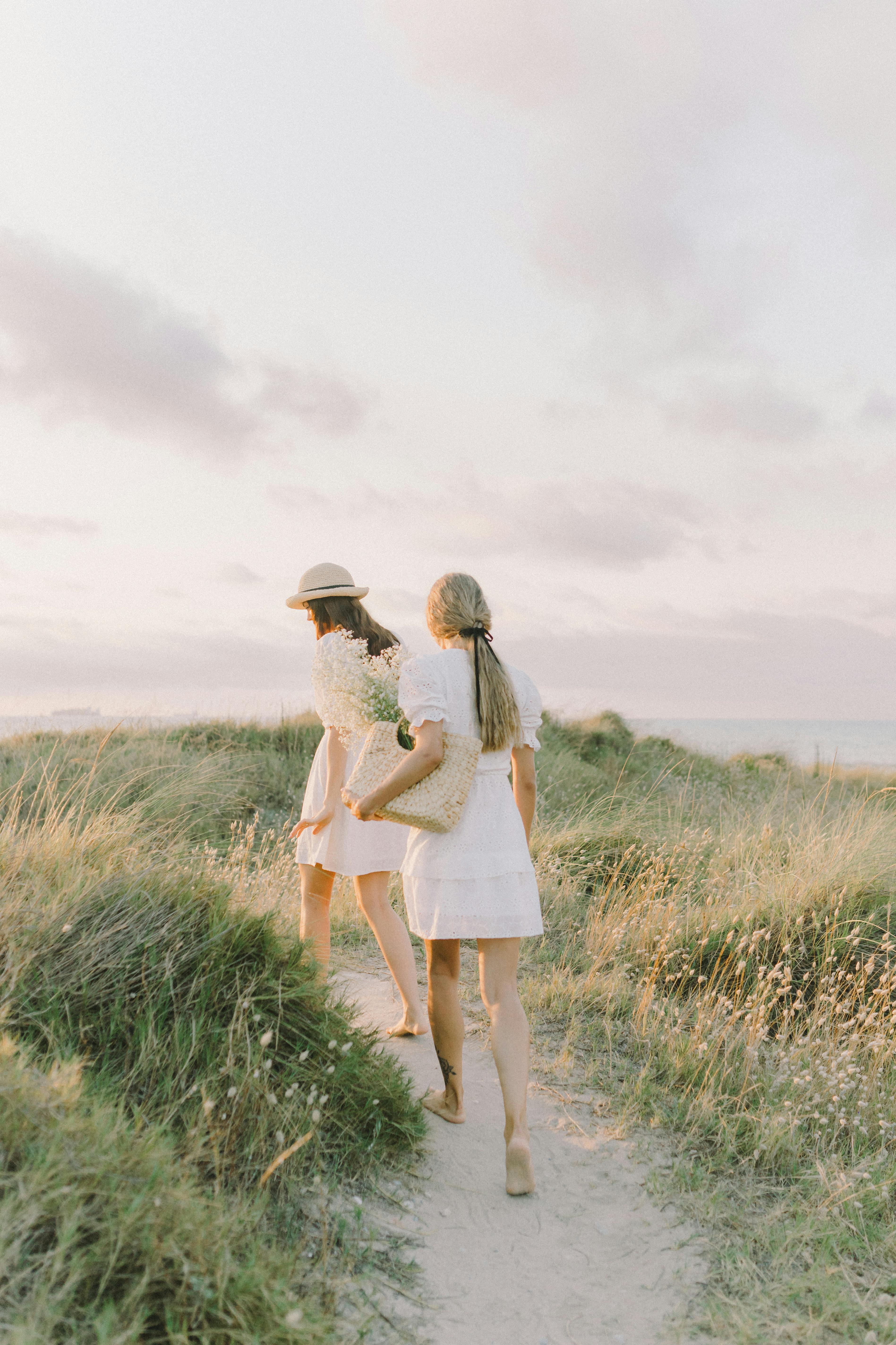 Women Walking on a Pathway · Free Stock Photo