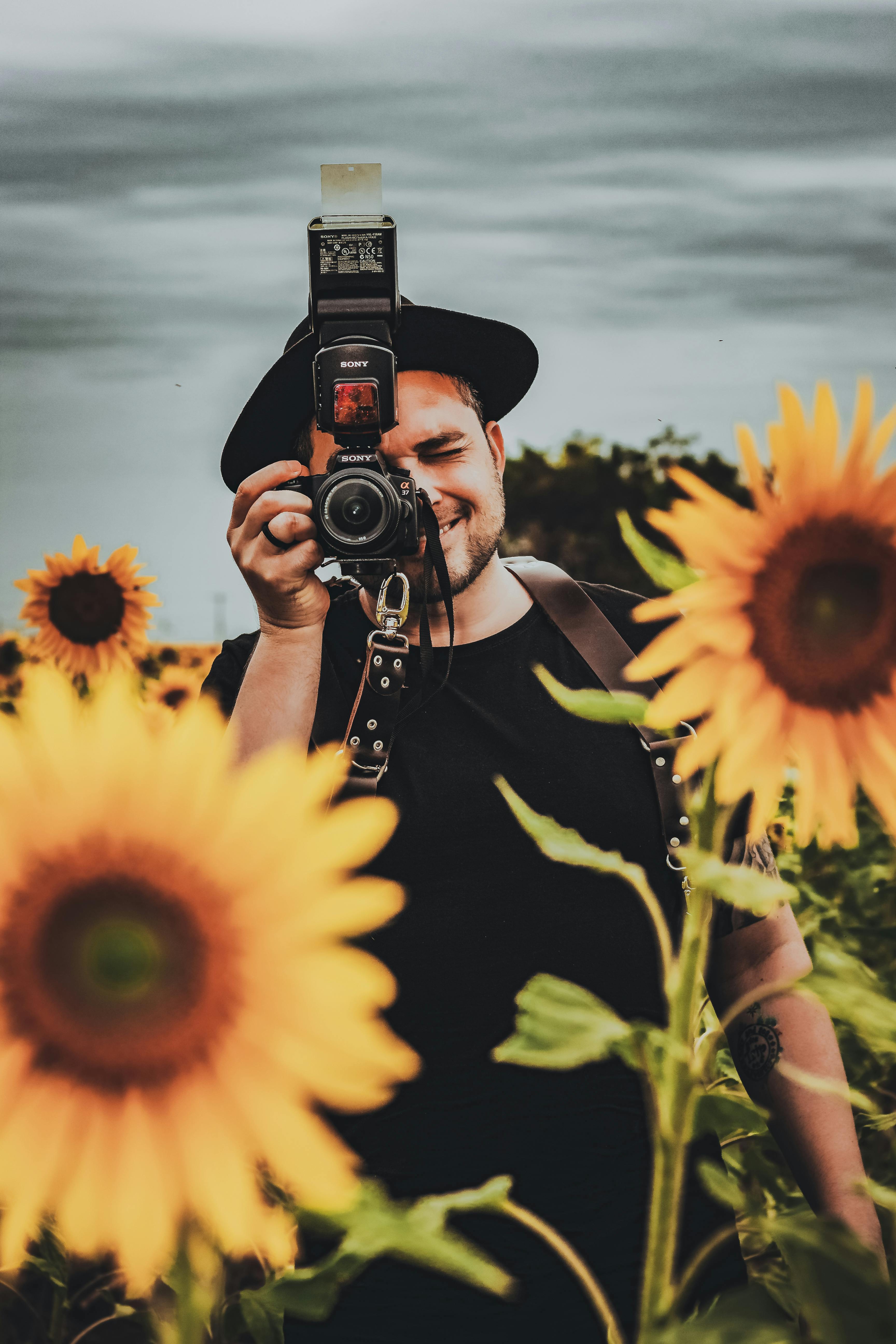 A Man Standing with a Camera · Free Stock Photo