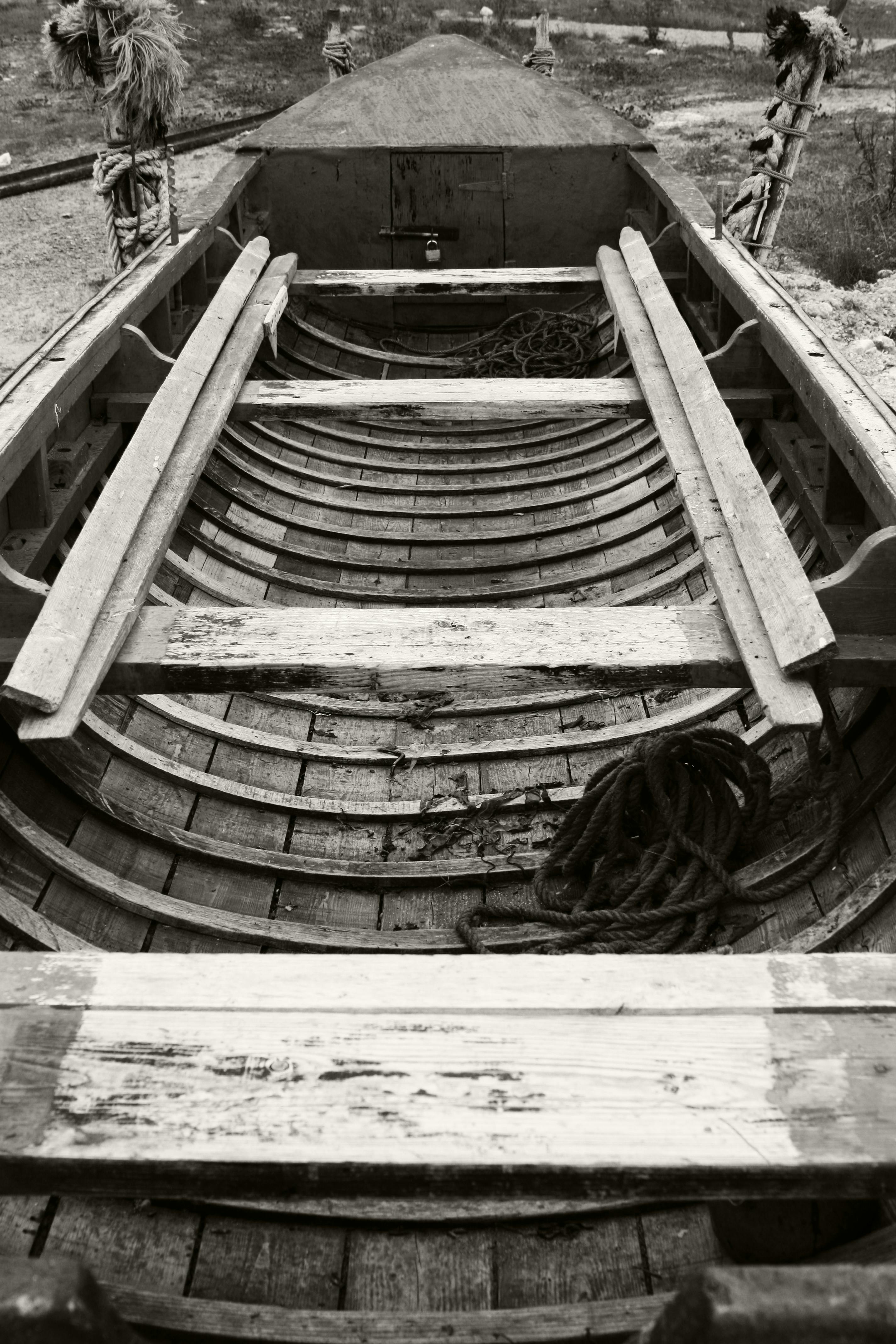 Grayscale Photo of a Wooden Boat · Free Stock Photo