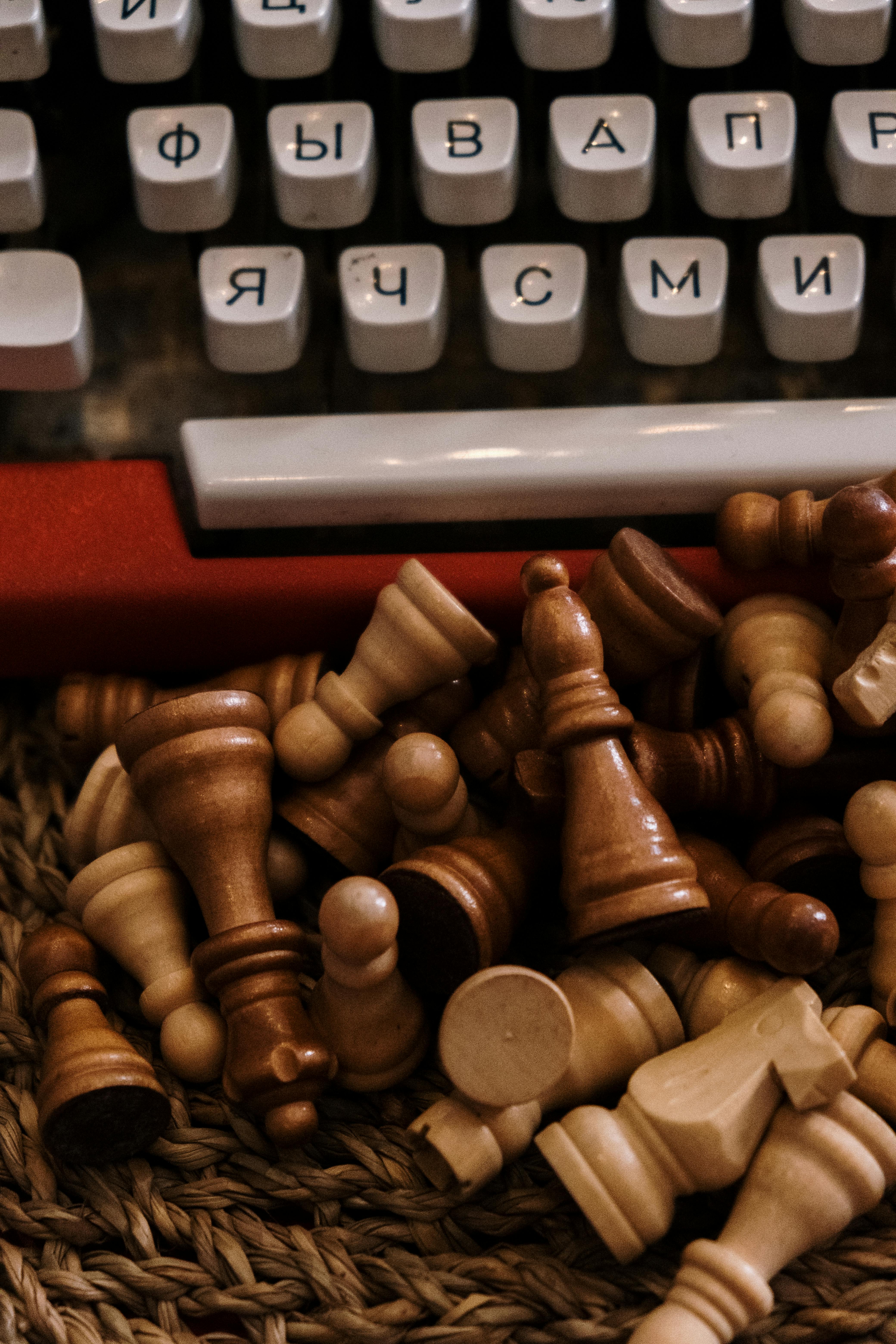 Chess Pieces Near Typewriter Keyboard · Free Stock Photo
