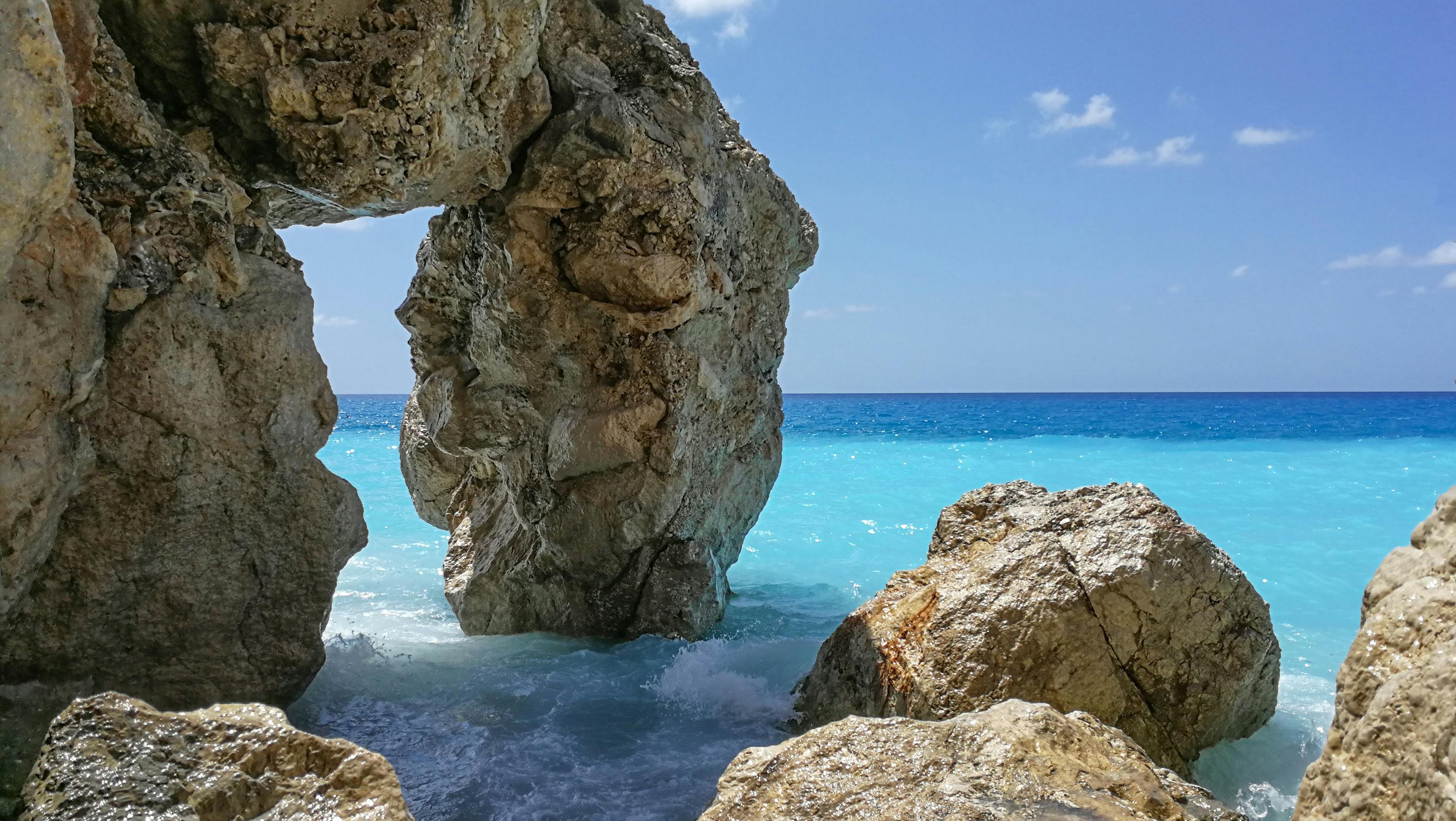 Brown Rocks Formation on the Blue Sea · Free Stock Photo