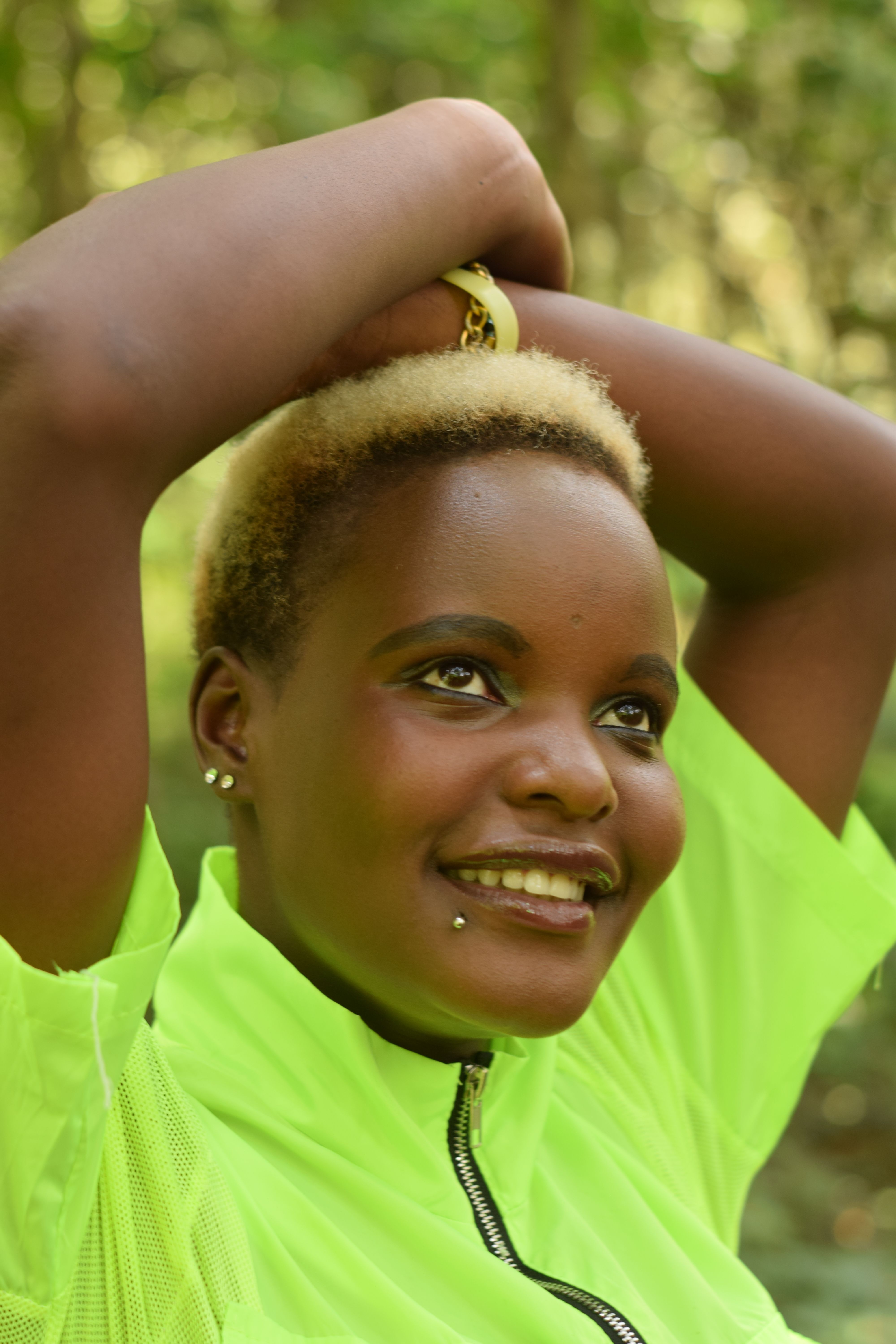 Woman in Yellow Shirt Raising Her Hands · Free Stock Photo