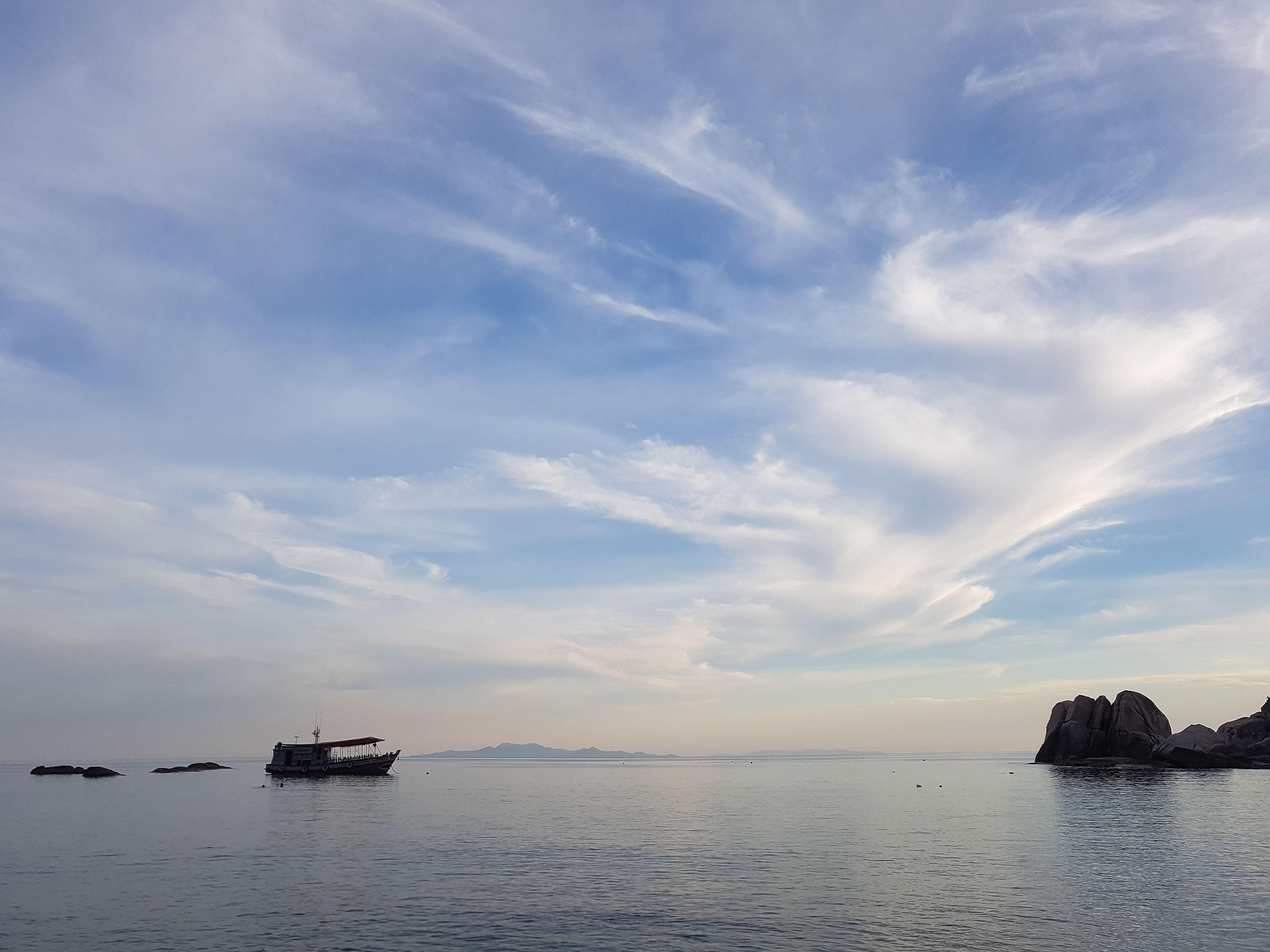 A Boat on the Sea in Distance · Free Stock Photo