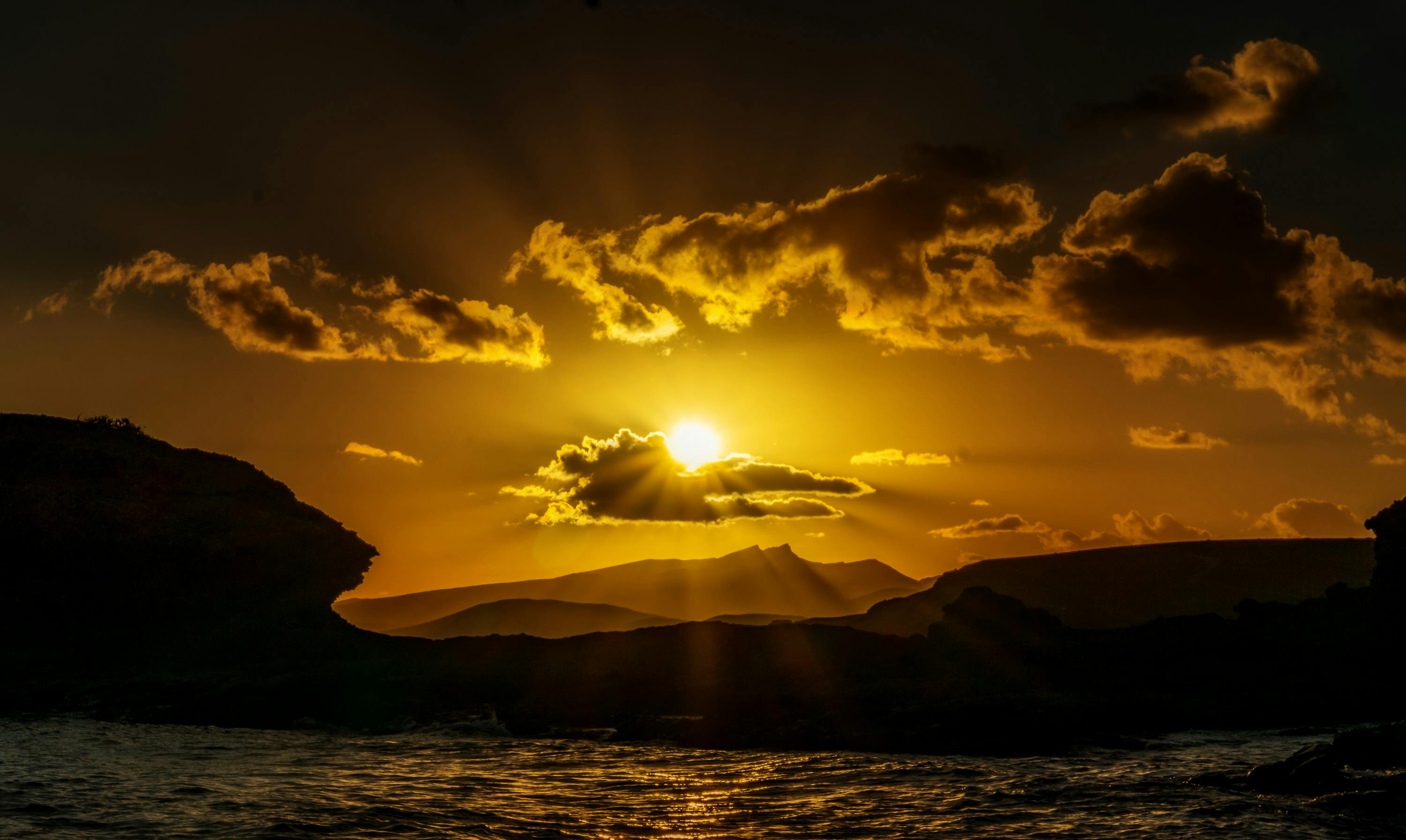 Sun Shining through Clouds · Free Stock Photo