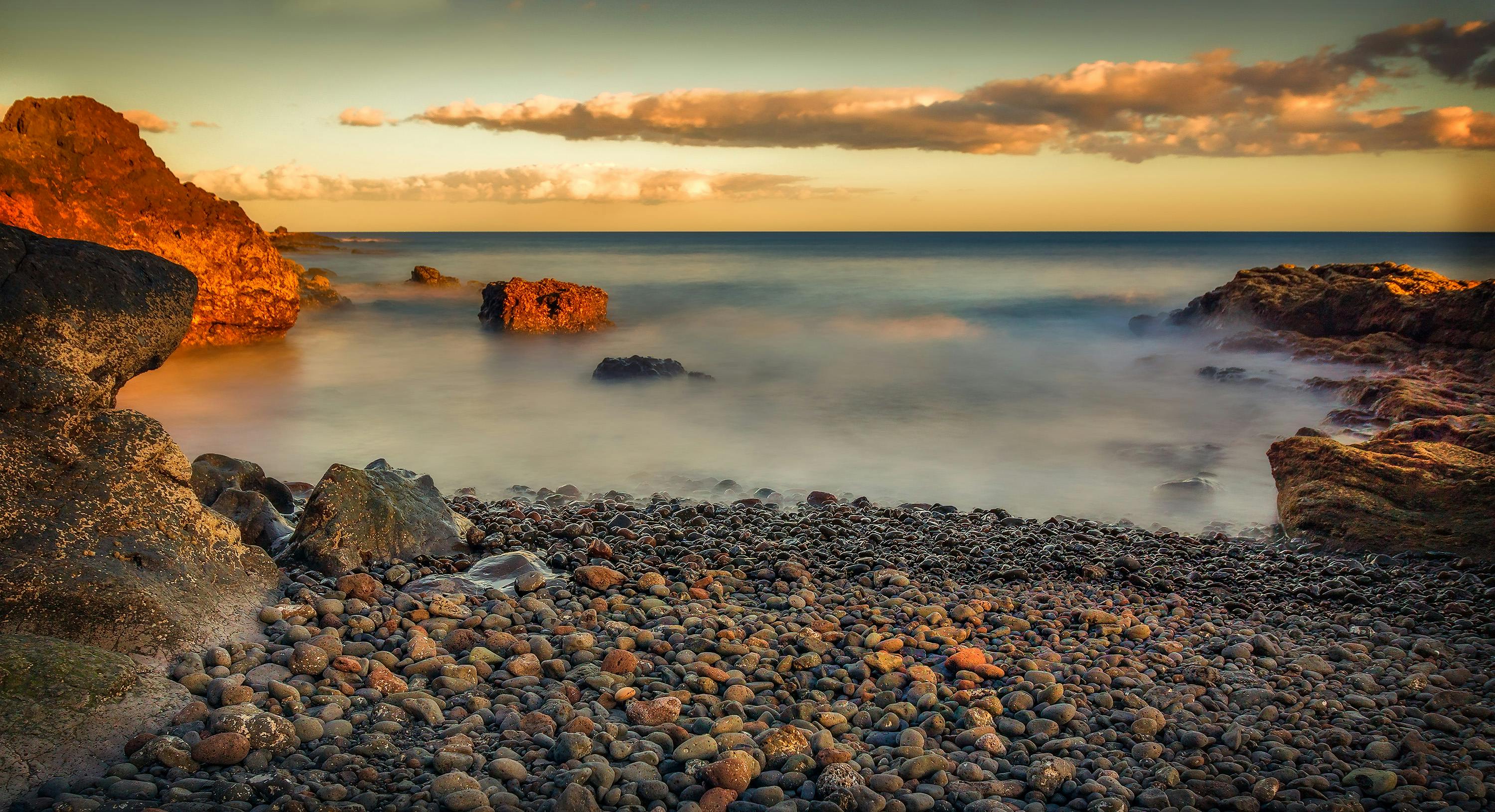 Photo of a Seacoast at Sunset · Free Stock Photo