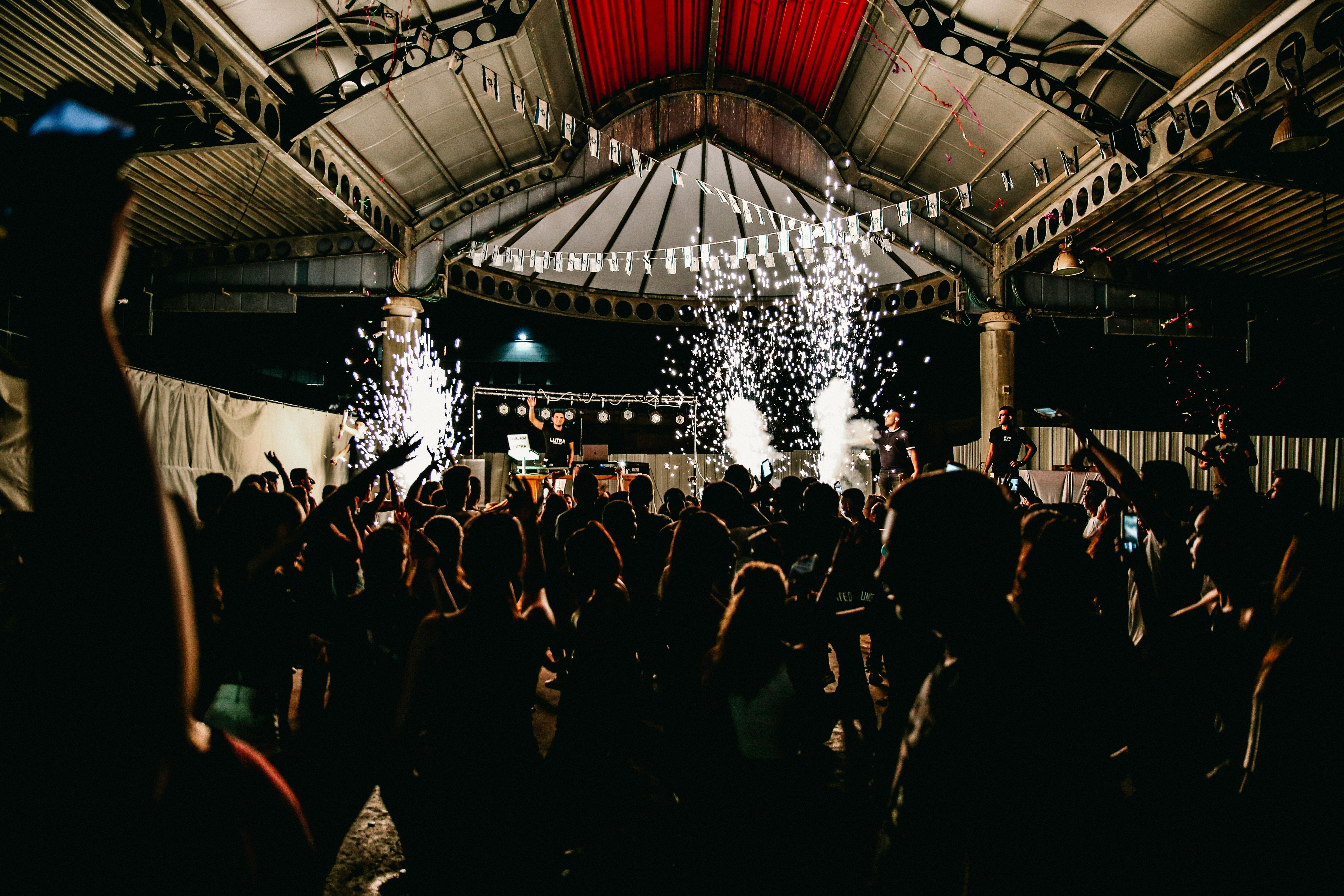 Group of People Watching A Live Show on Stage · Free Stock Photo