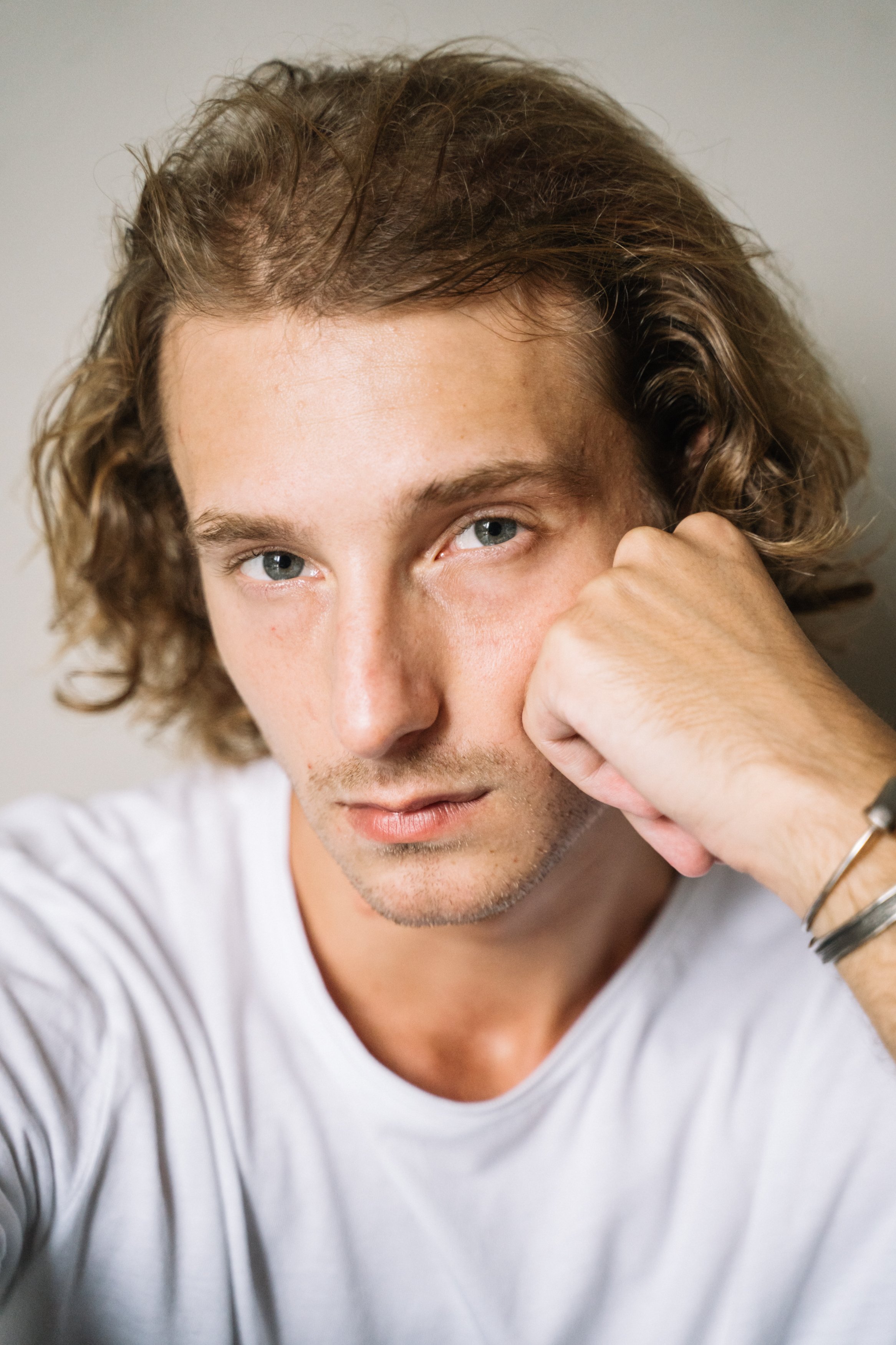 A Close-Up Shot of a Man Leaning on His Hand · Free Stock Photo